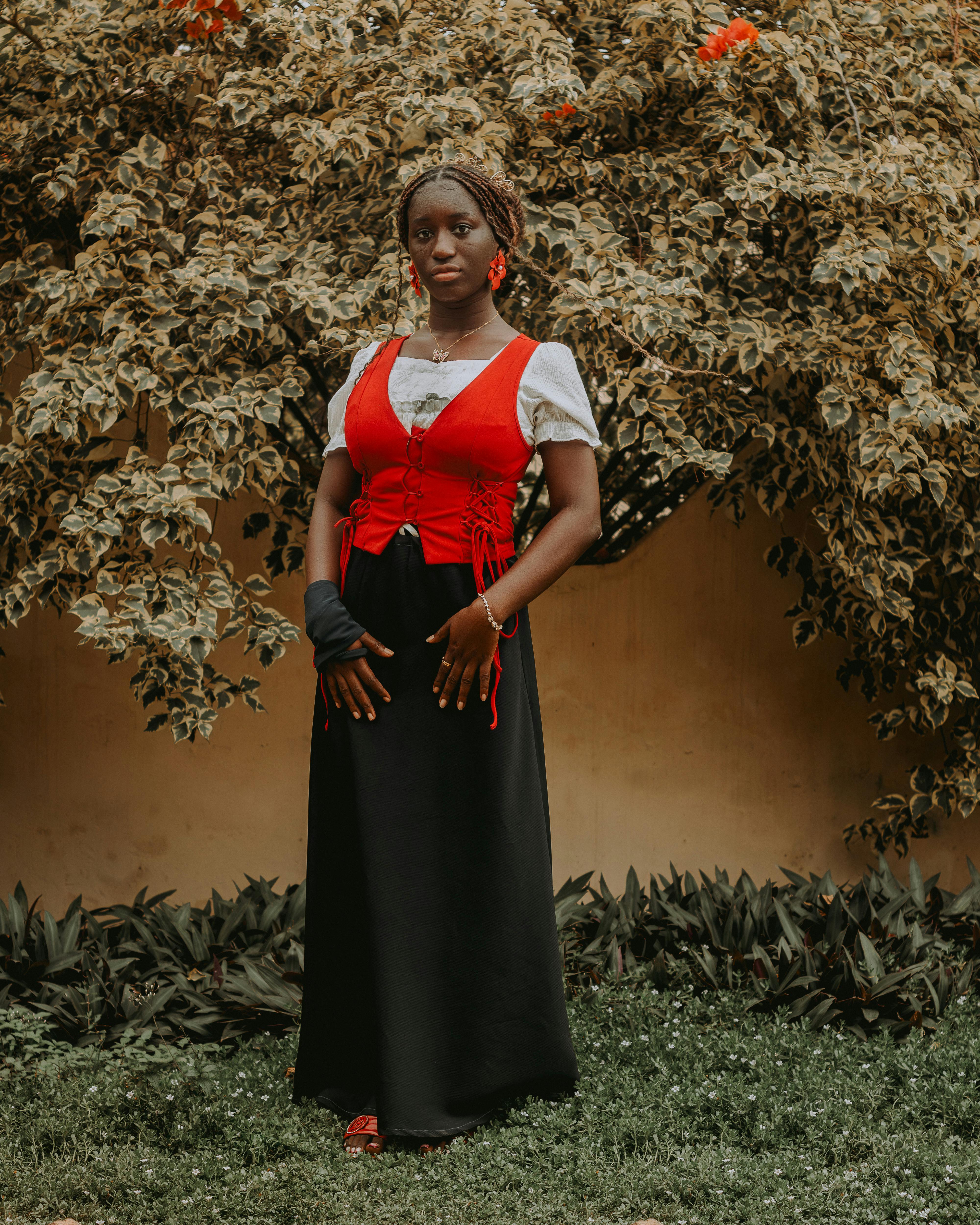 Elegant Portrait of Woman in Red and Black Ensemble · Free Stock Photo