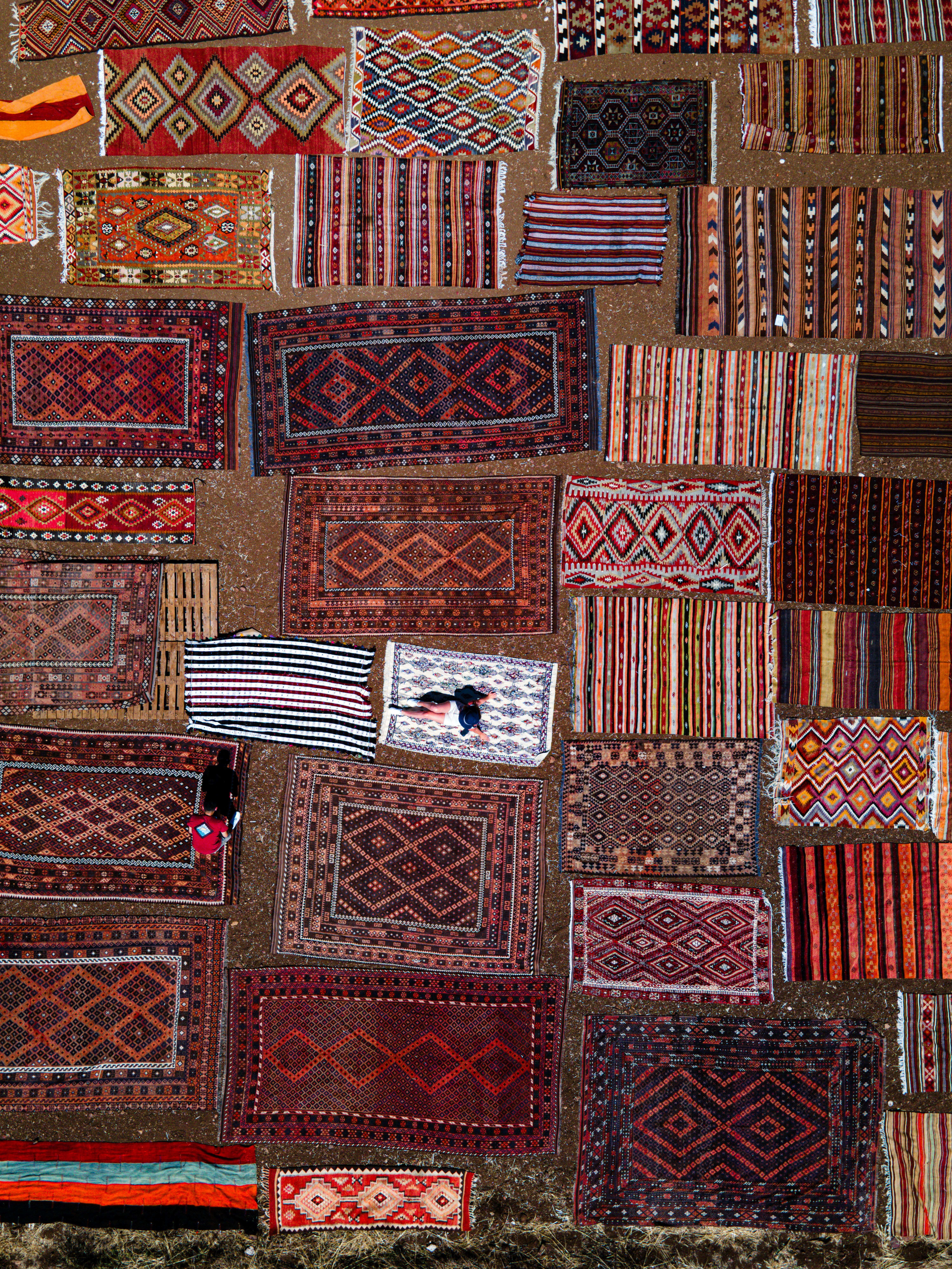 Aerial View of Colorful Traditional Rugs Displayed Outdoors · Free ...
