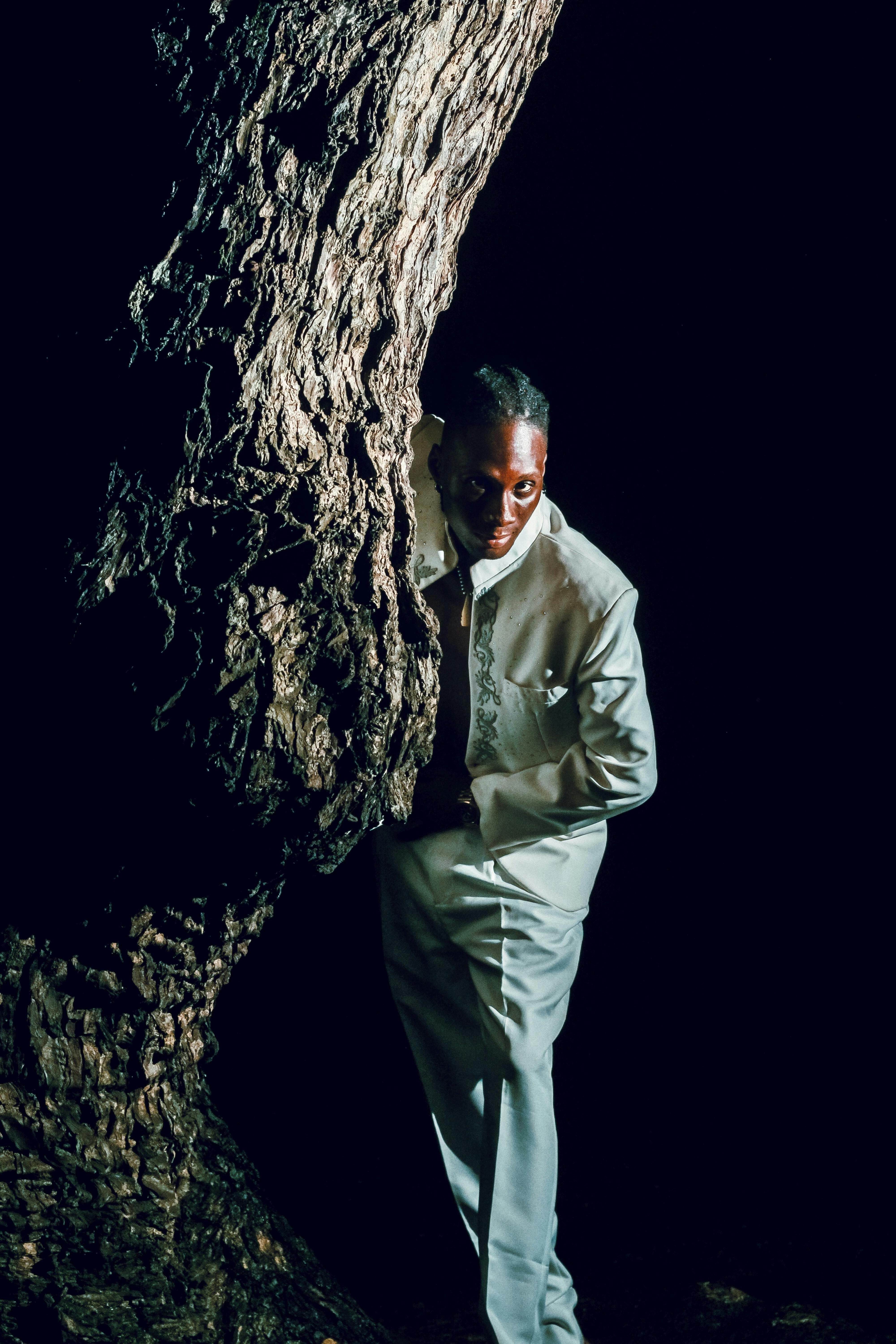 Mysterious Portrait of Man Behind Tree at Night · Free Stock Photo