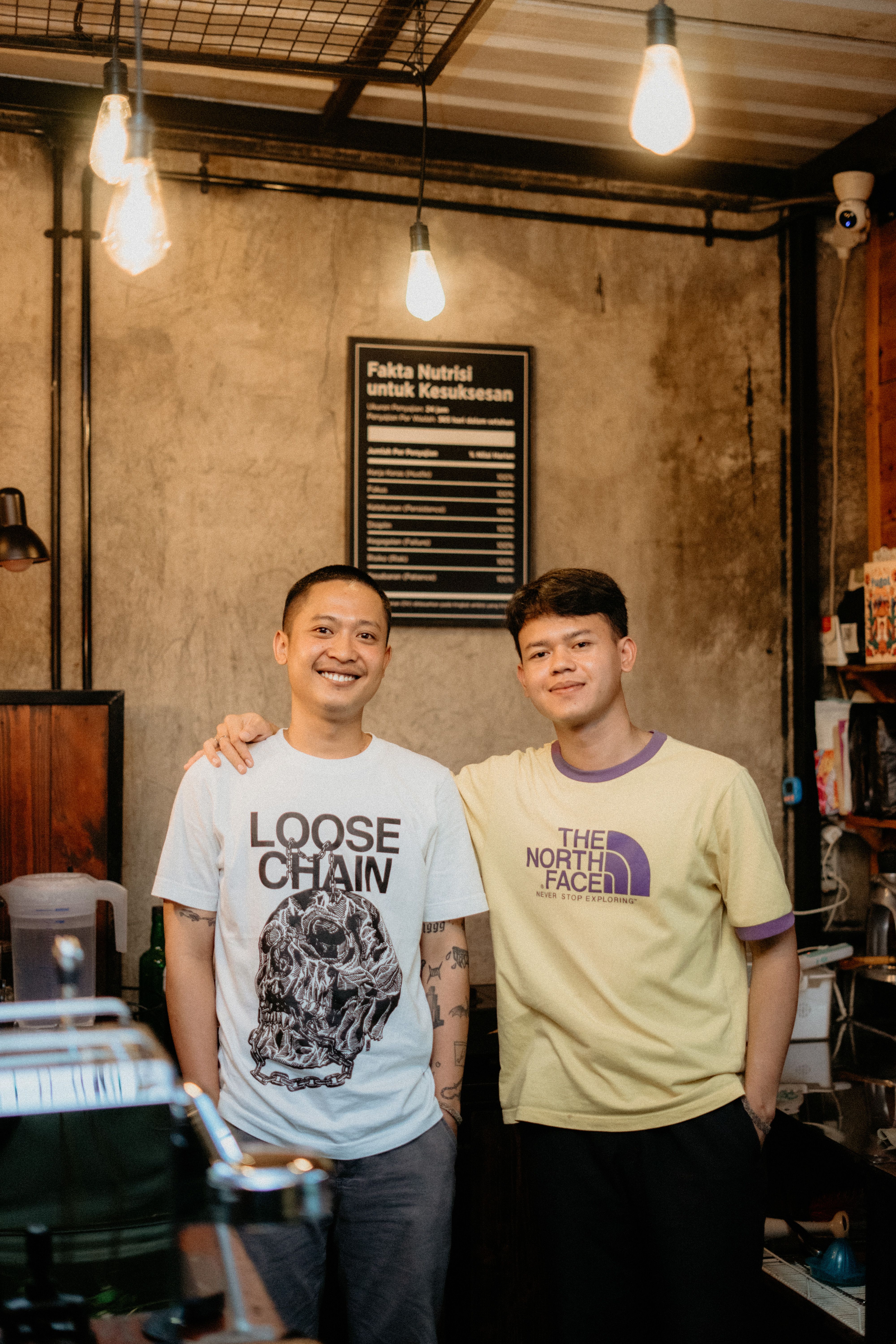 Casual Portrait of Two Young Men in Urban Cafe · Free Stock Photo