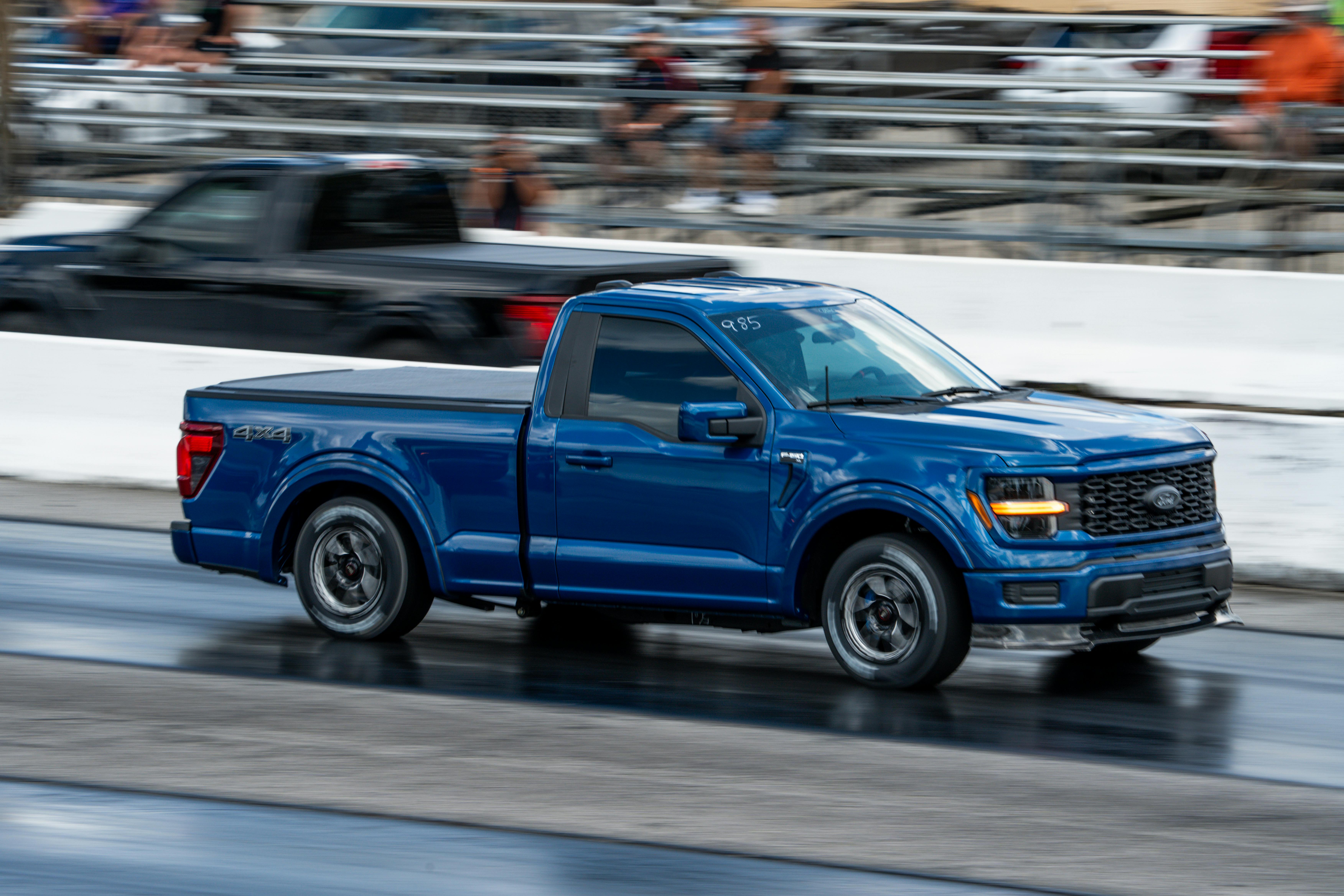 High-Speed Blue Pickup Truck on Race Track · Free Stock Photo