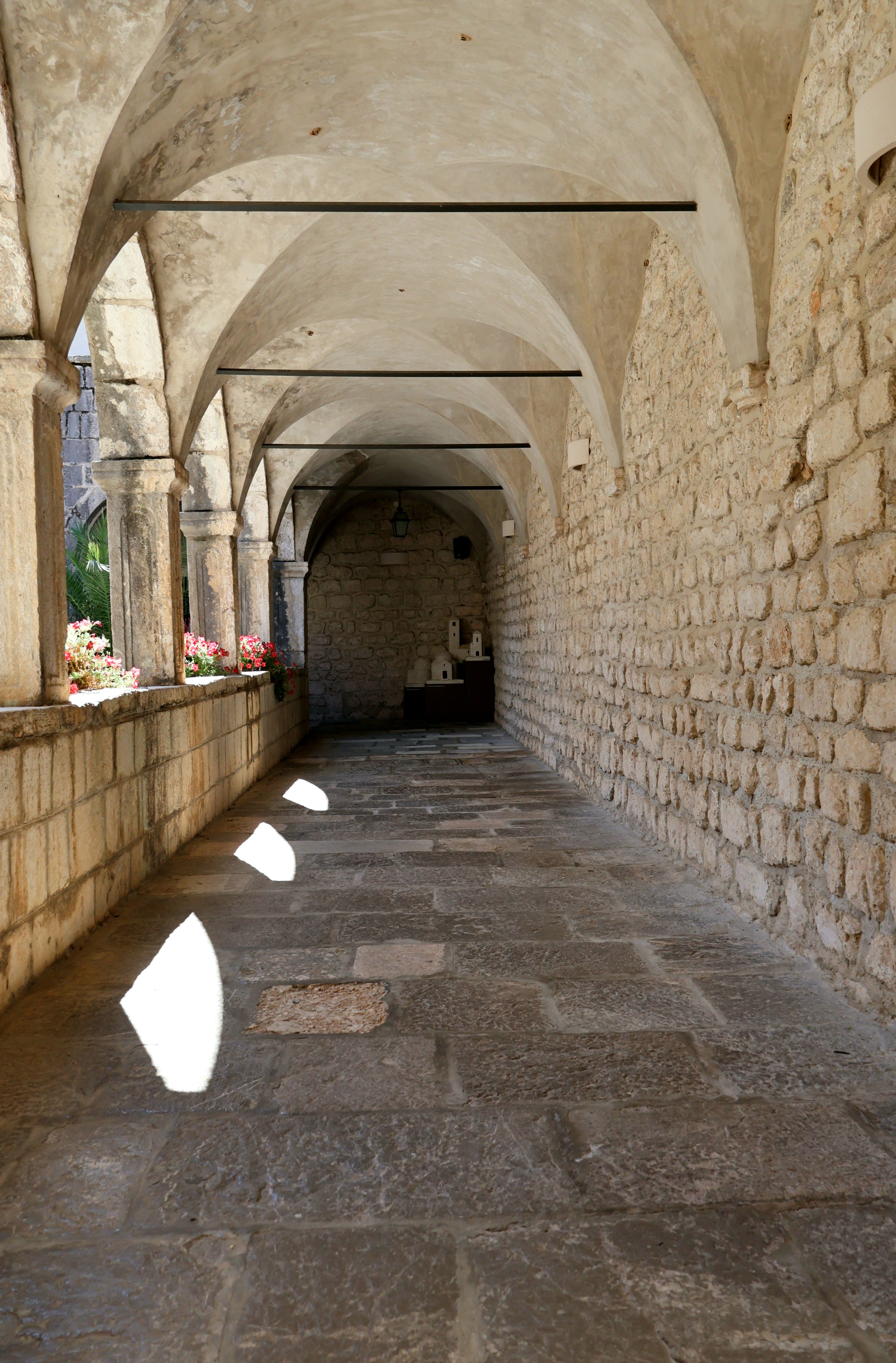 Historic Stone Corridor with Arched Ceilings · Free Stock Photo