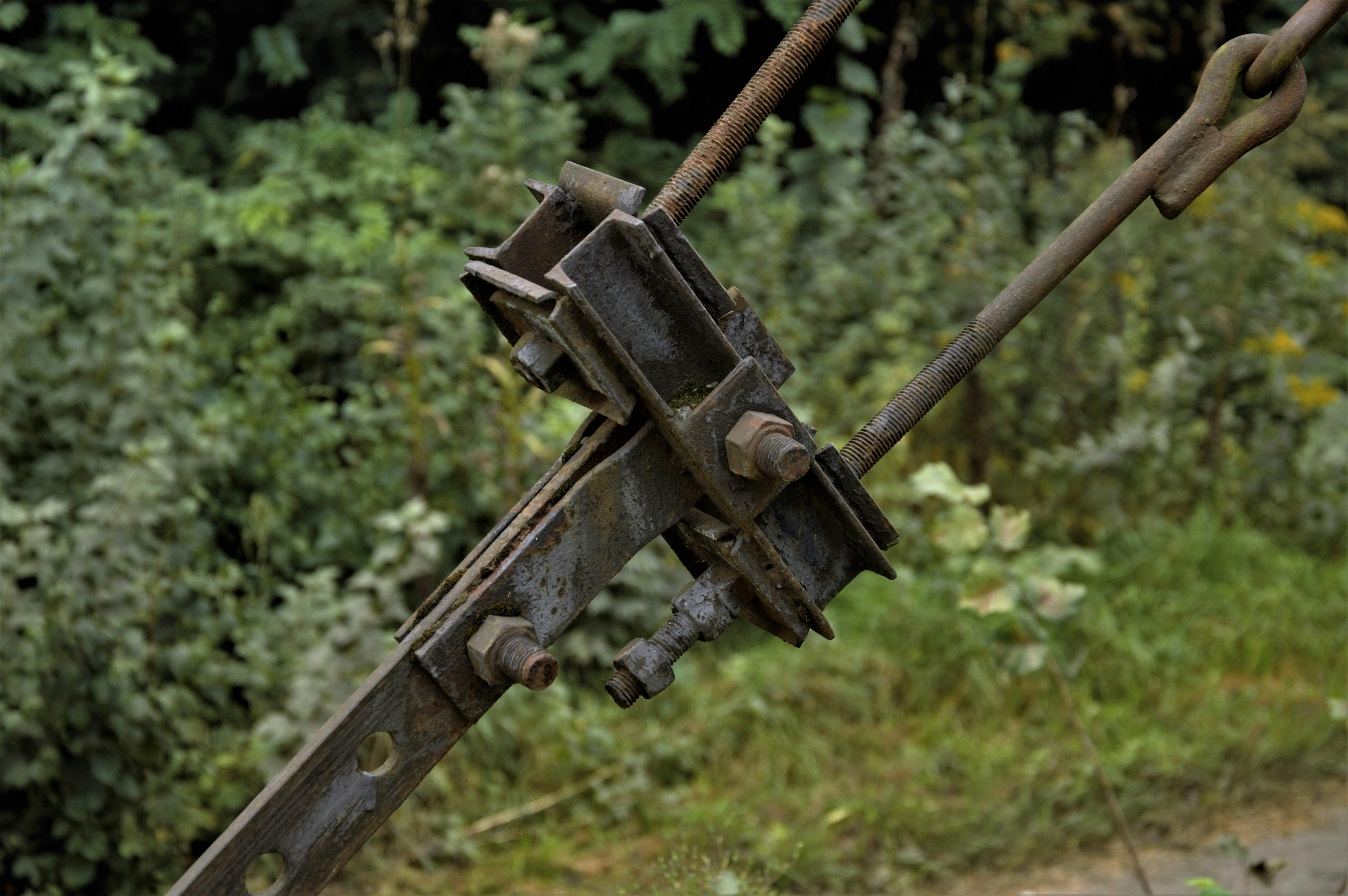 Rusty Metal Clamp in Industrial Setting Outdoors · Free Stock Photo