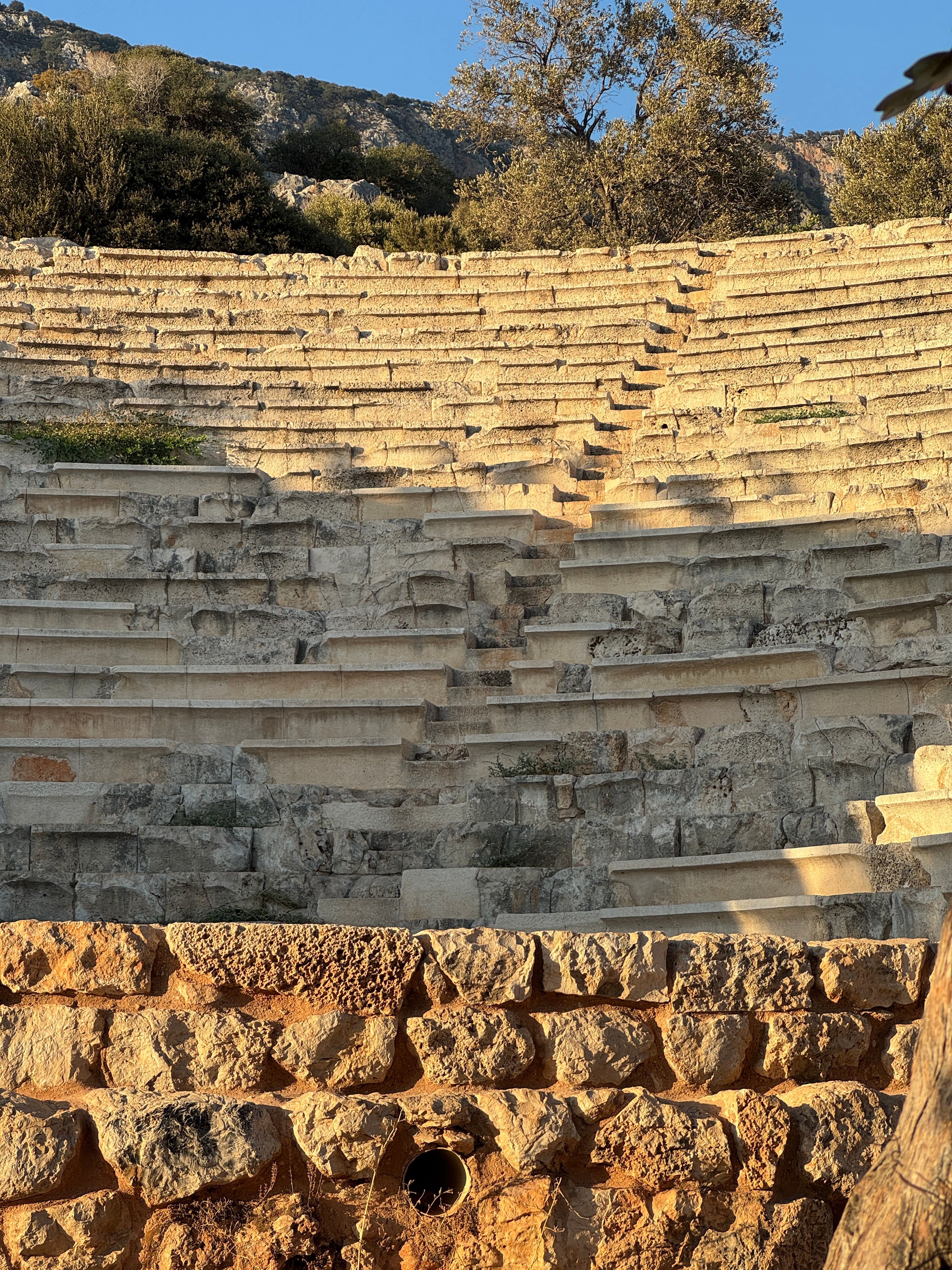 Ancient Stone Amphitheater in Scenic Outdoor Setting · Free Stock Photo