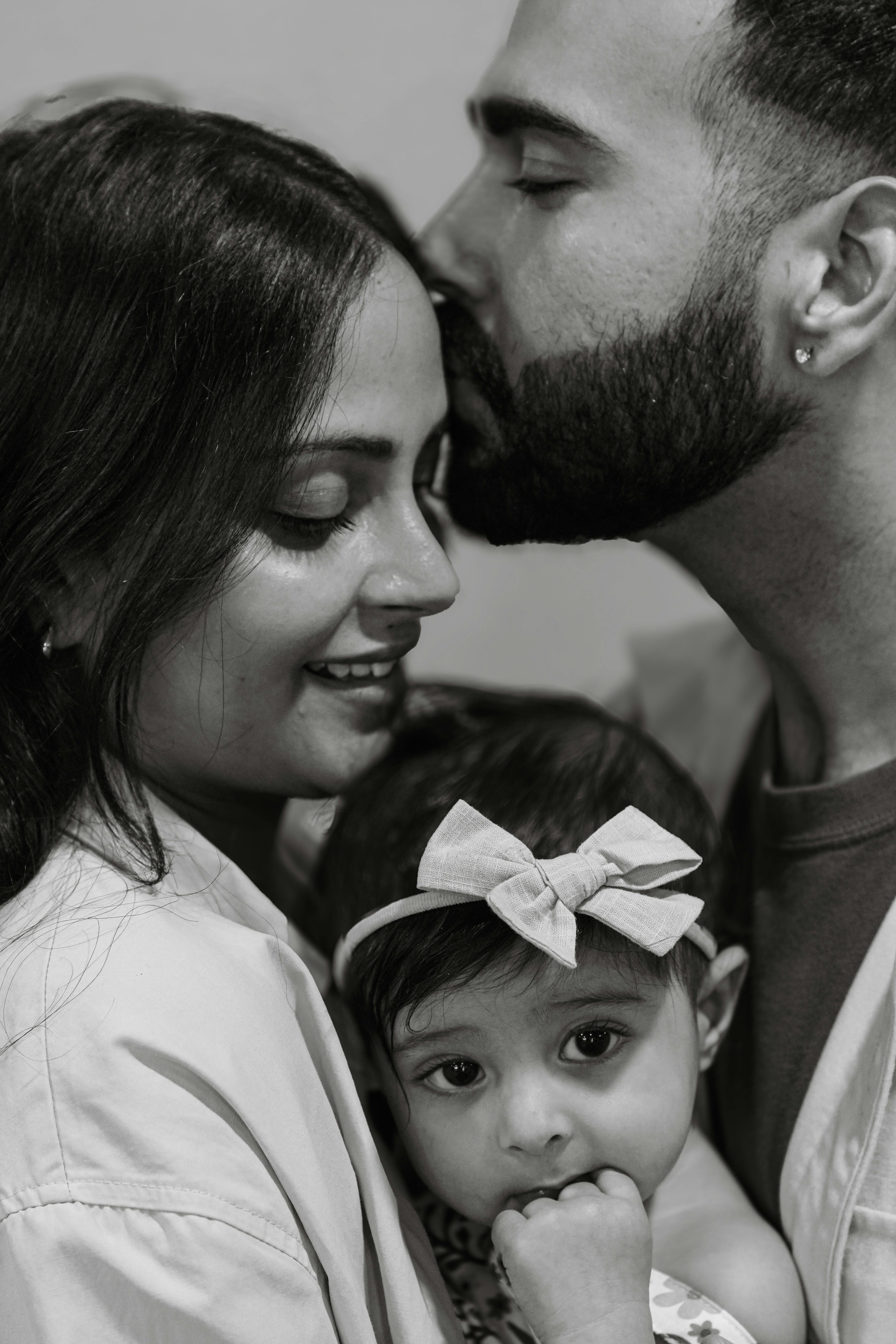 Tender Family Moment Captured in Black and White · Free Stock Photo