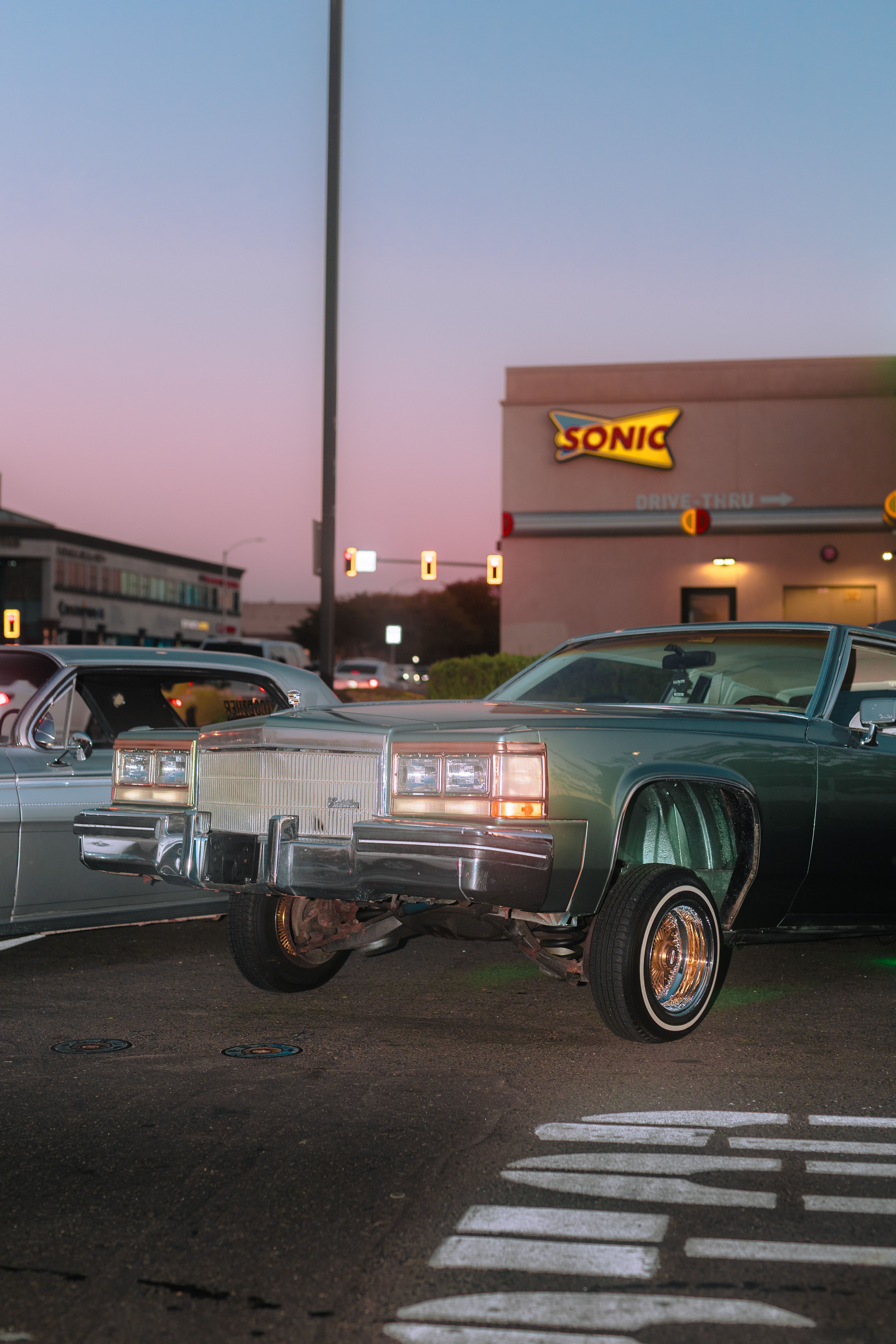Classic Lowrider Car at Sunset Outside Sonic · Free Stock Photo