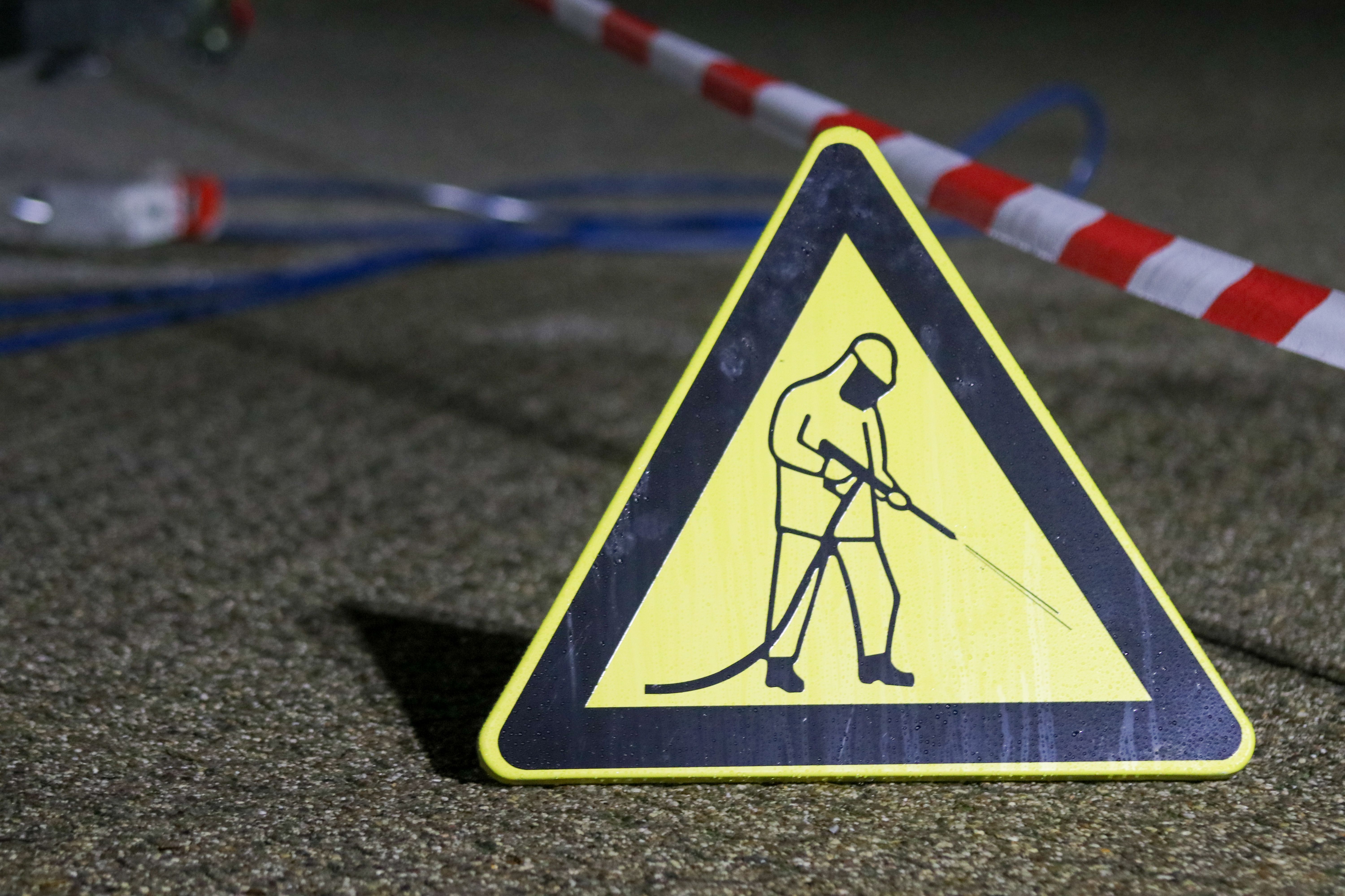 Caution Sign for Pressure Washer Safety at Night · Free Stock Photo