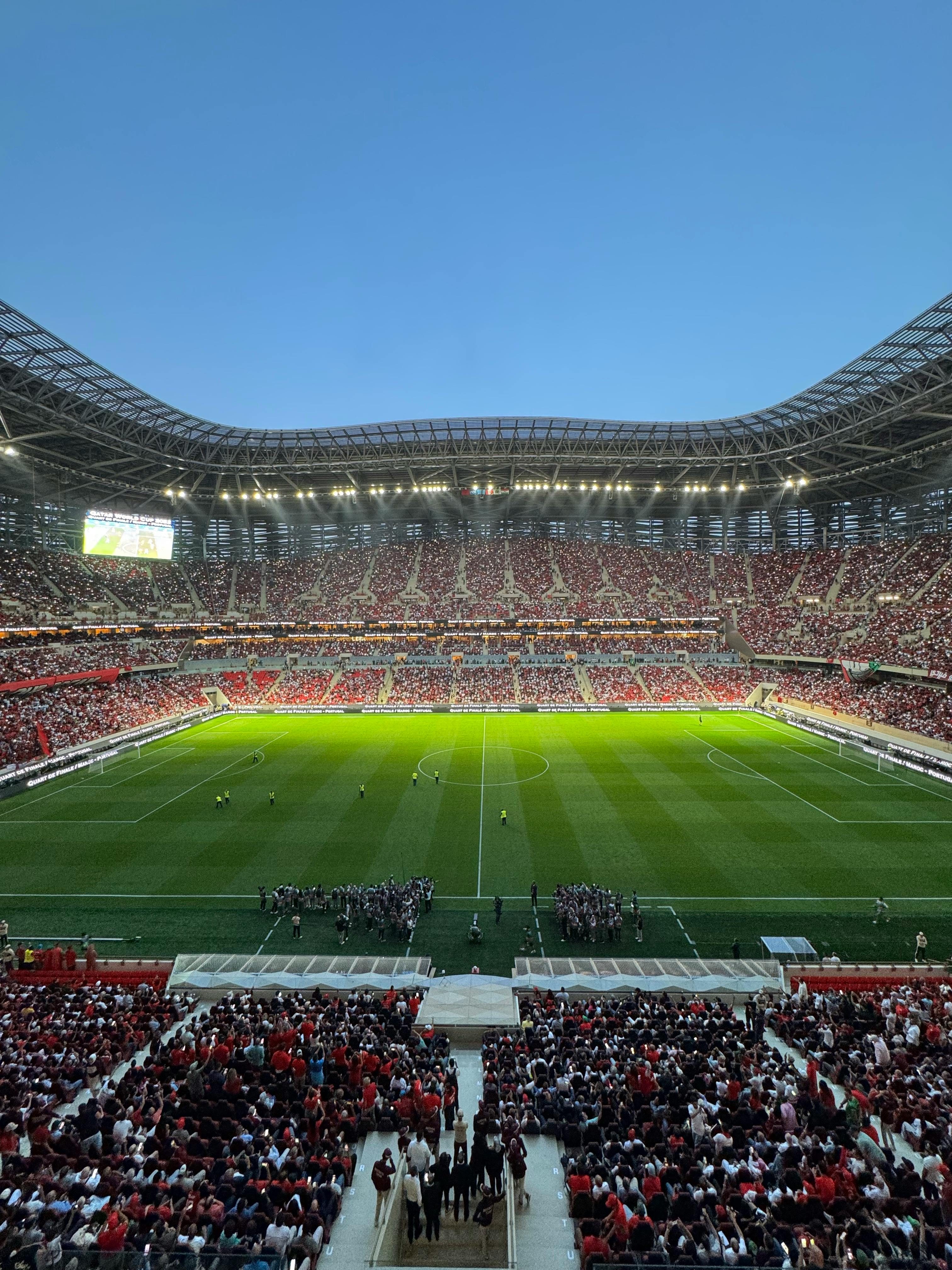 Vibrant Soccer Match in a Packed Stadium · Free Stock Photo