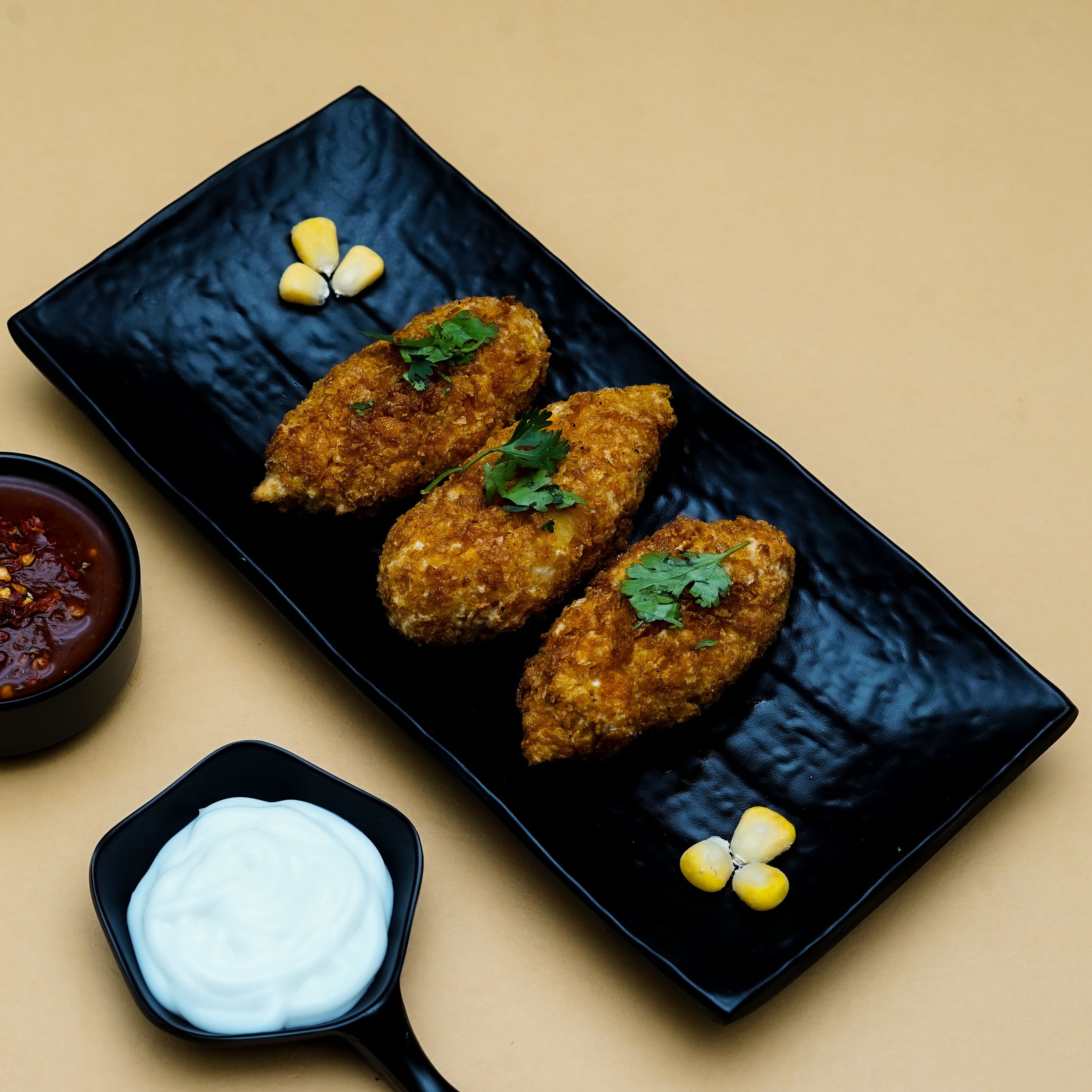 Delicious Crispy Corn Croquettes with Dips · Free Stock Photo