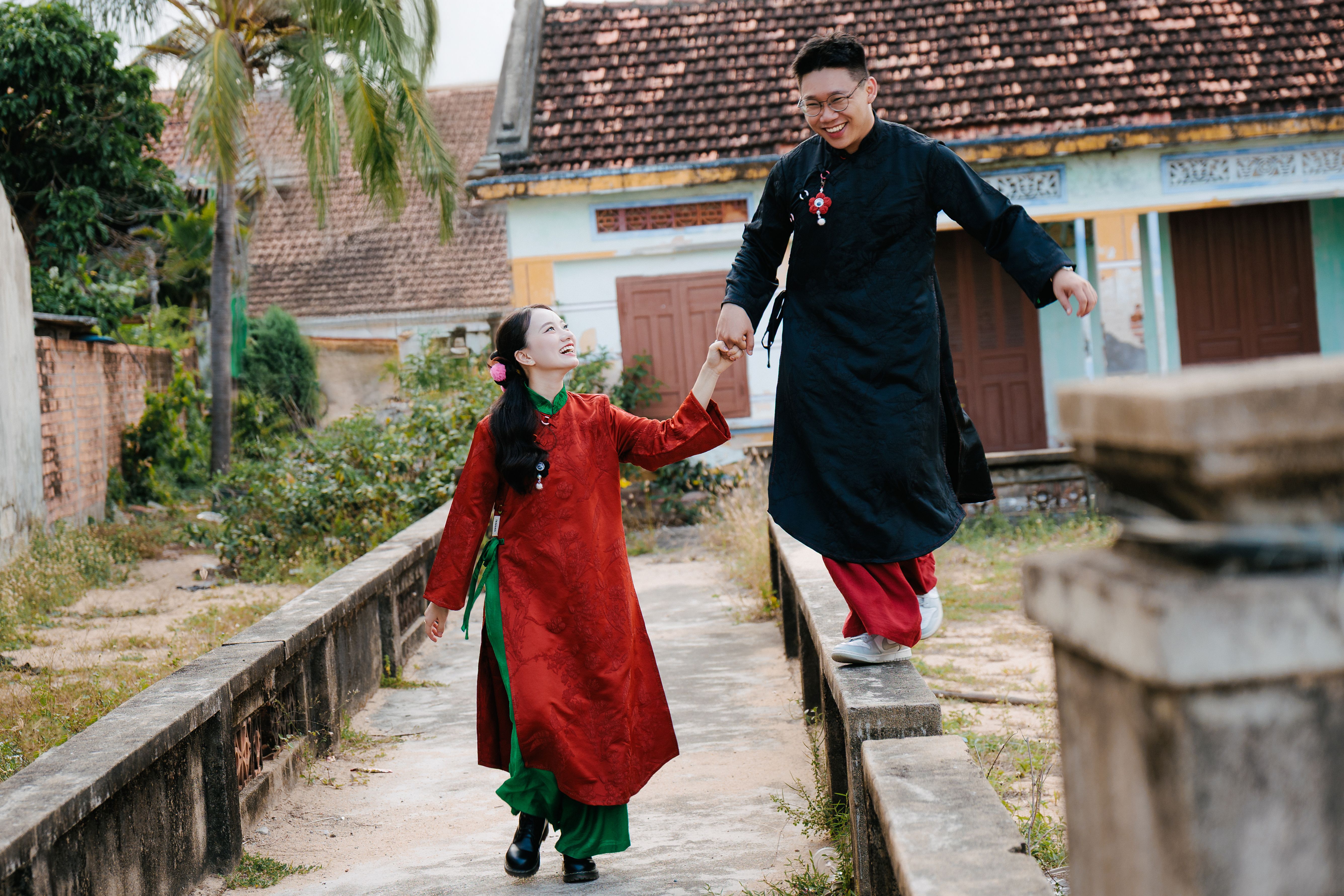 Couple in Traditional Vietnamese Clothing Outdoors · Free Stock Photo