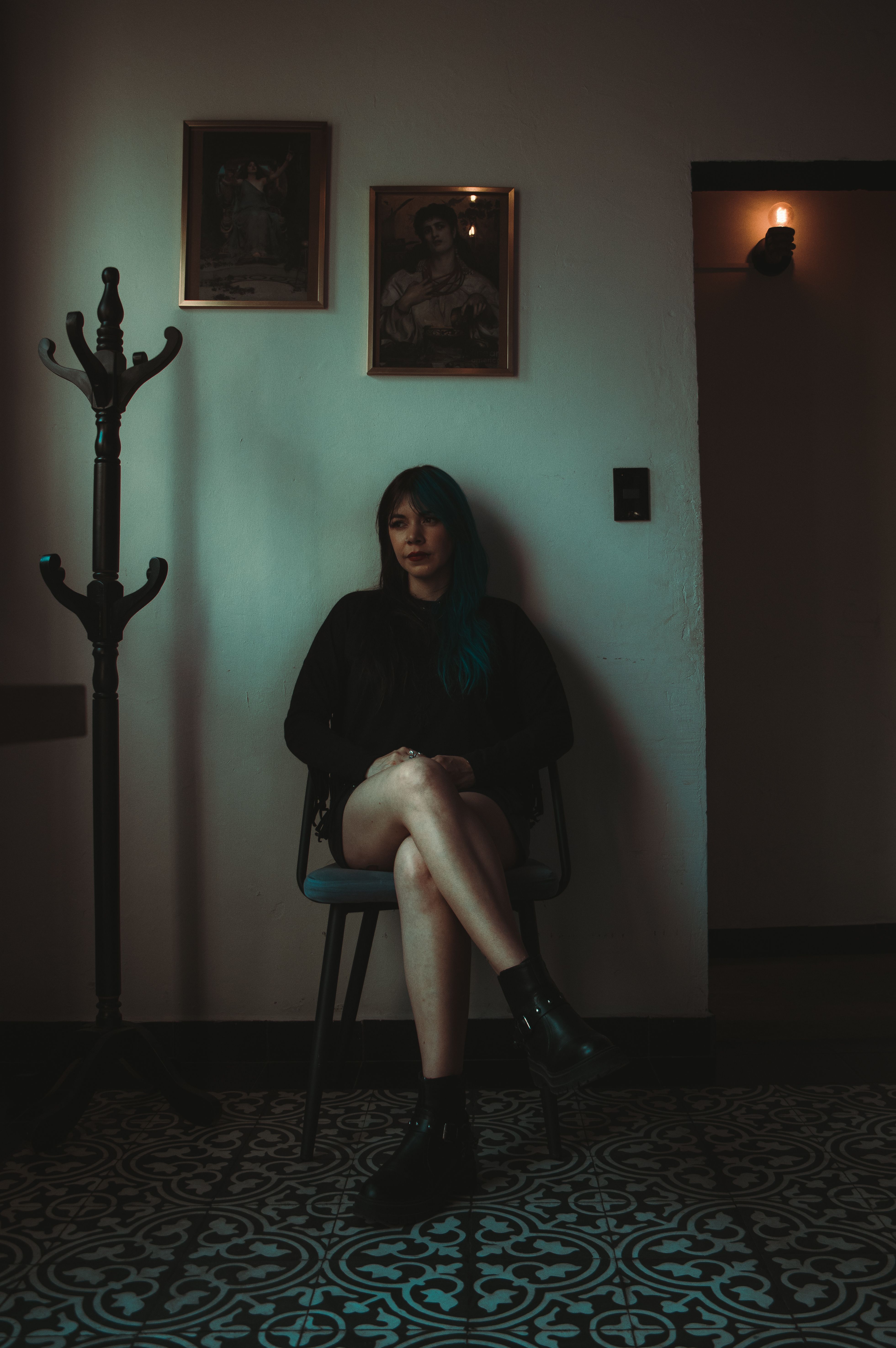 Moody Portrait of Woman in Dimly Lit Room · Free Stock Photo