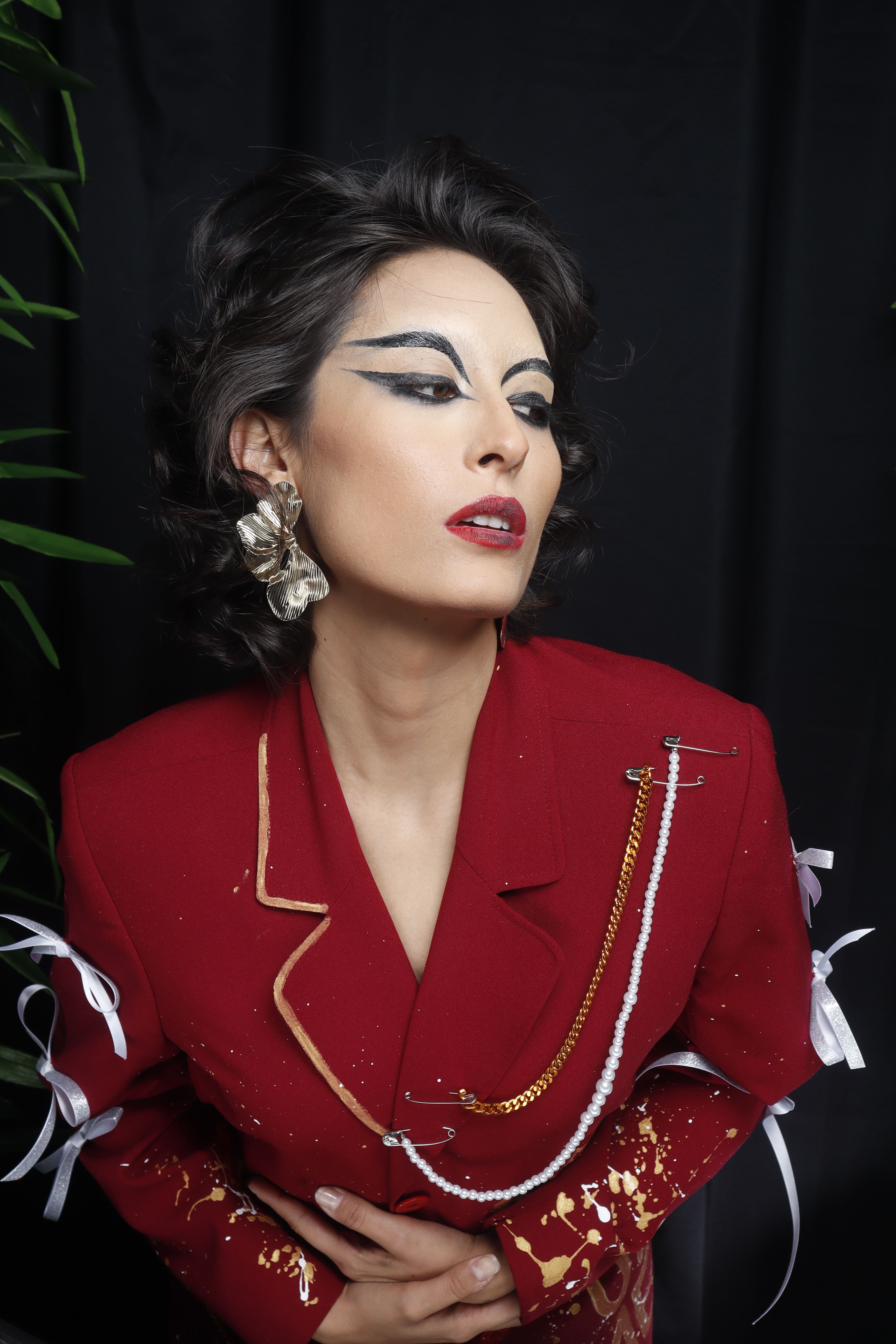Stylish Woman in Red Suit with Dramatic Makeup · Free Stock Photo
