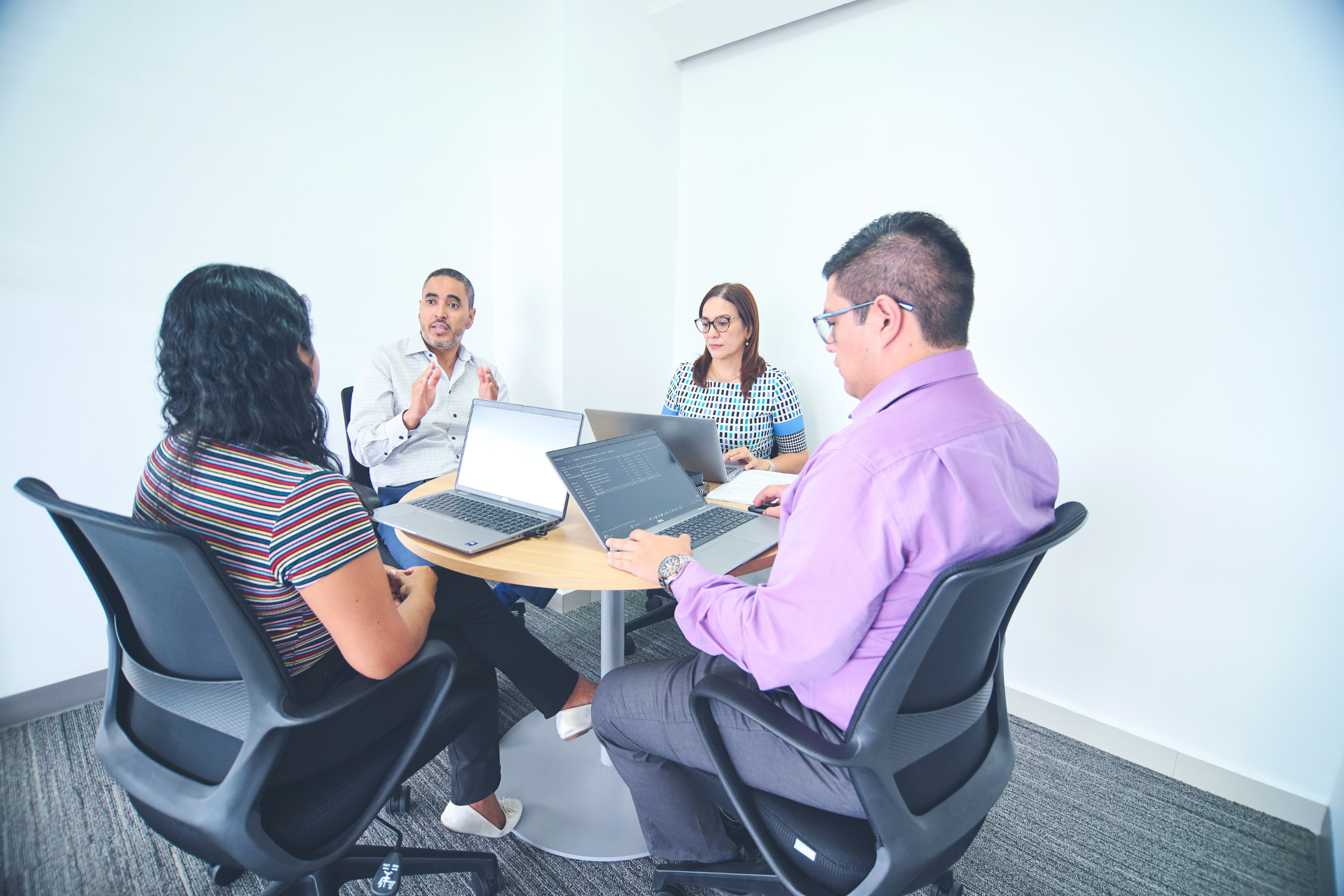 Collaborative Team Meeting in Modern Office · Free Stock Photo