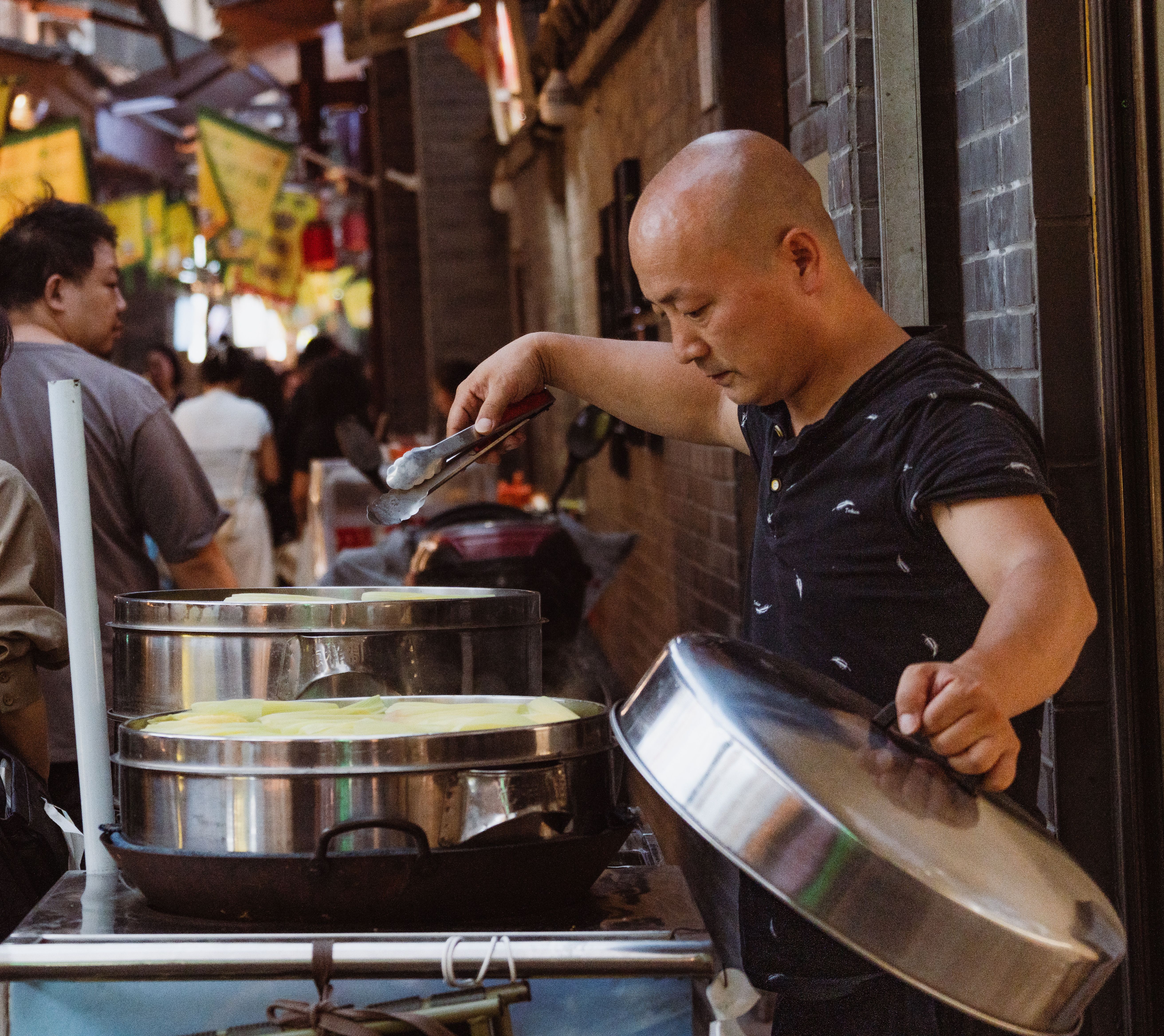 Street Vendor Cooking Chinese Street Food · Free Stock Photo
