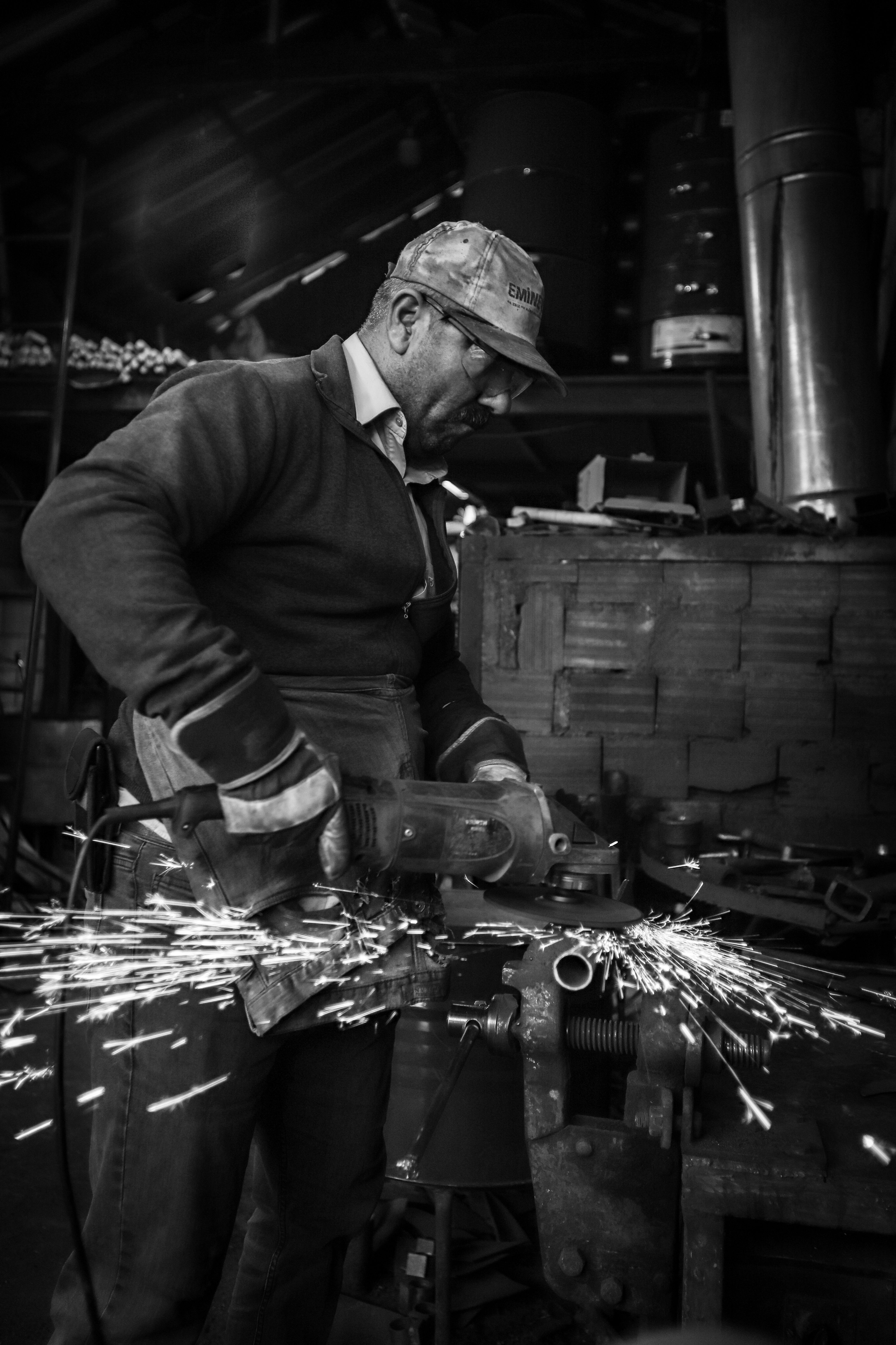 Black and White Photo of Metalworker Grinding · Free Stock Photo