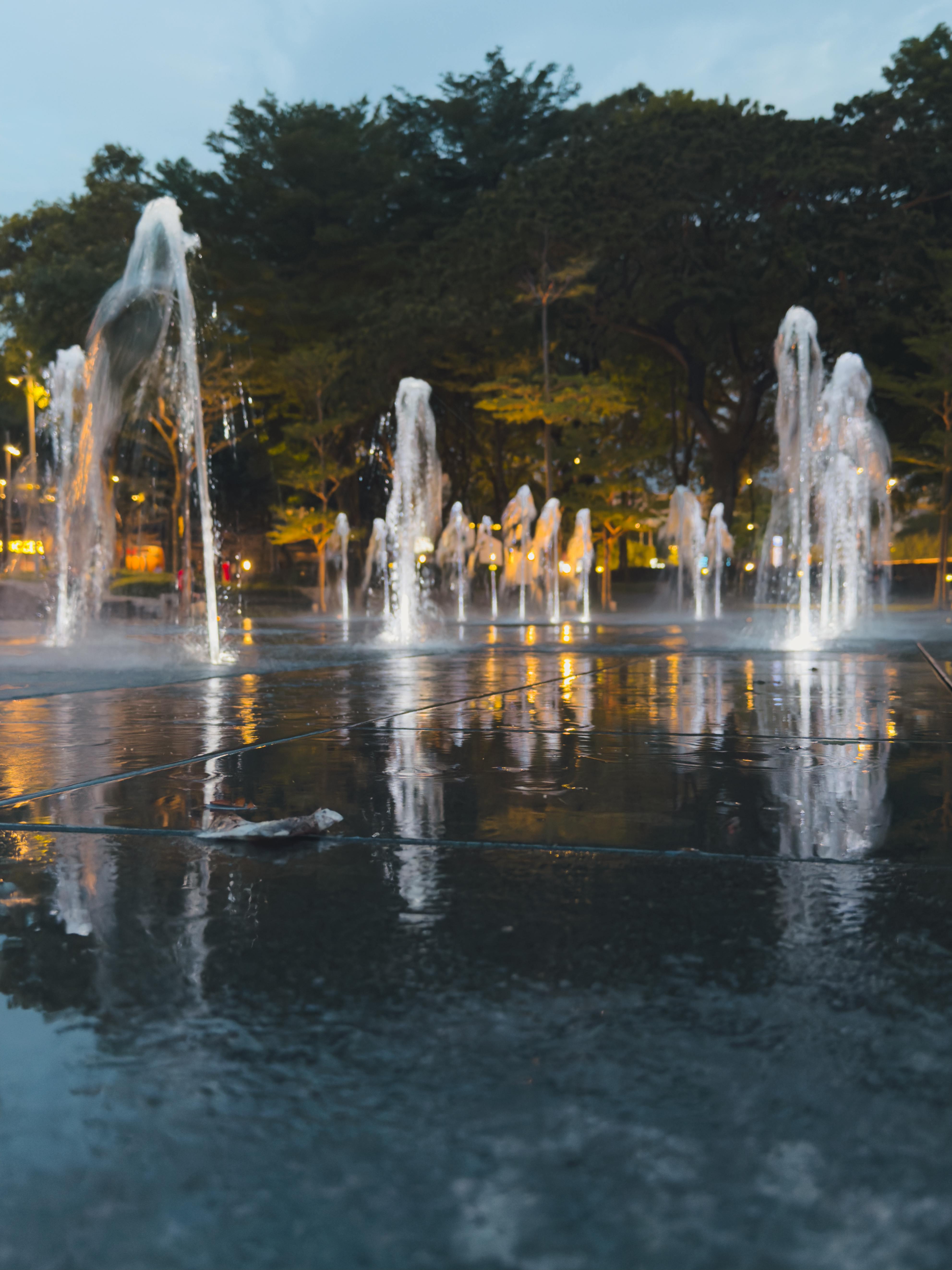 Fountain Display at Night in Lively City Park · Free Stock Photo