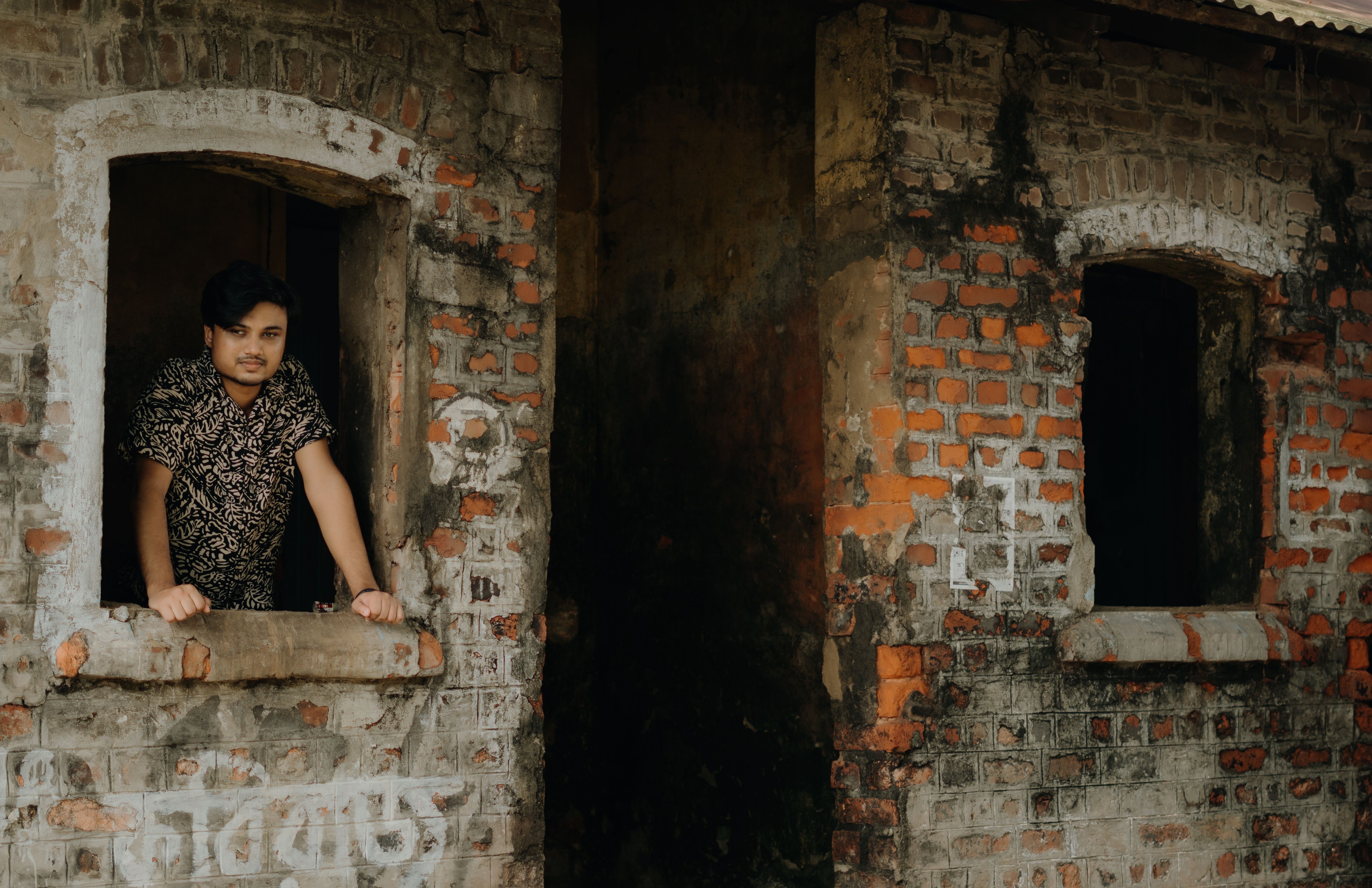 Man Hiding Behind A Concrete Wall · Free Stock Photo
