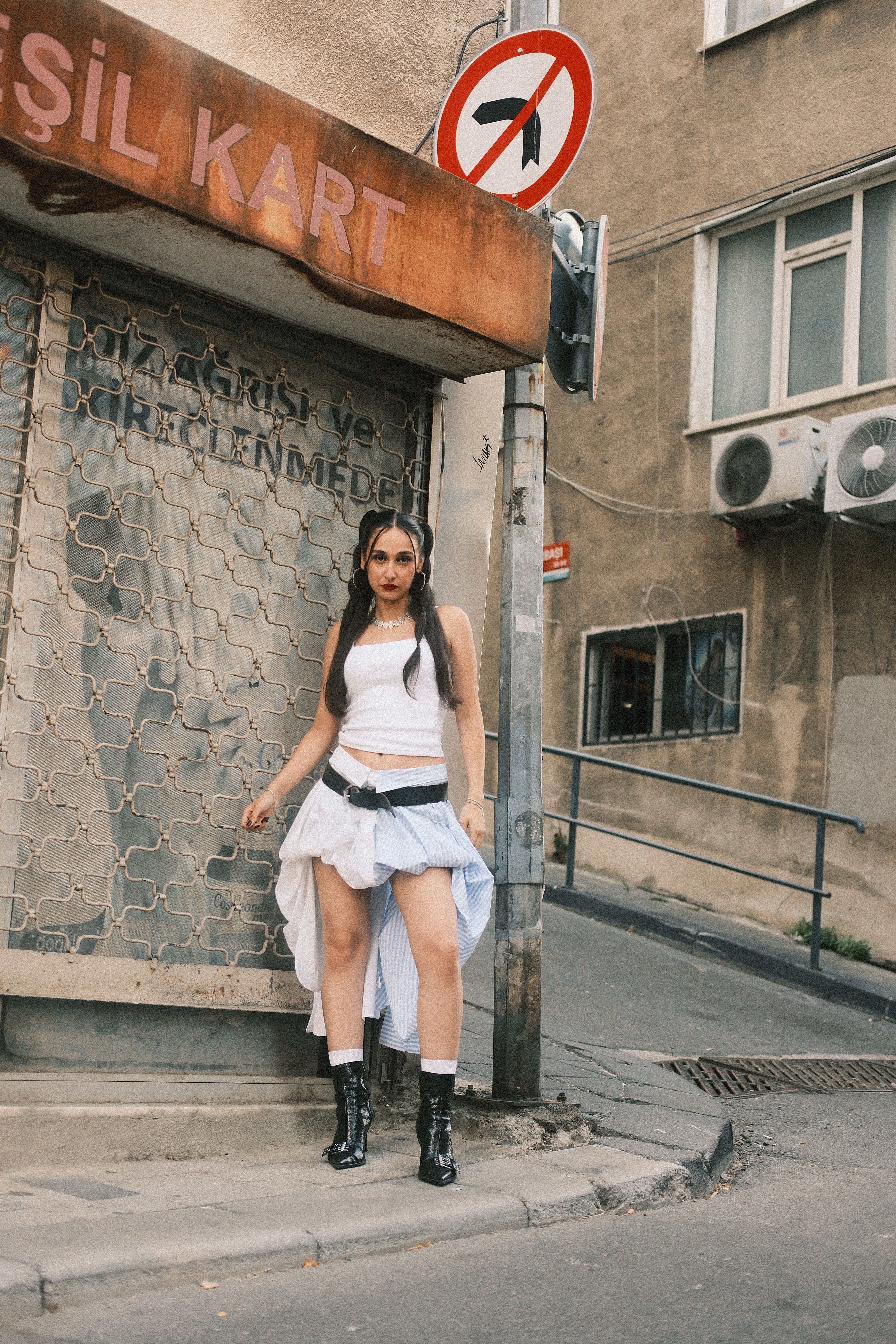 Trendy Woman Posing on Urban Street Corner · Free Stock Photo