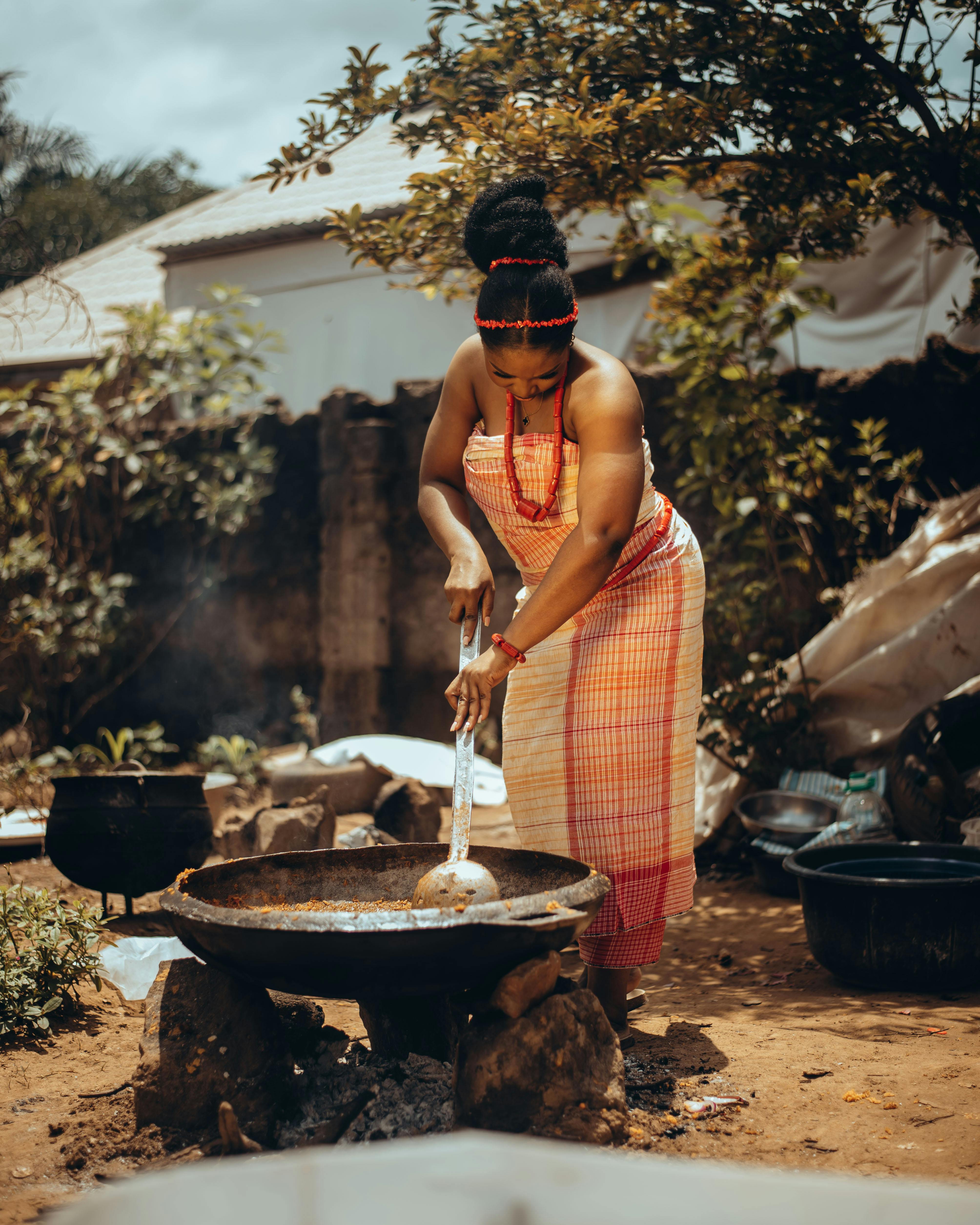 Traditional Nigerian Cooking Outdoors in EN · Free Stock Photo