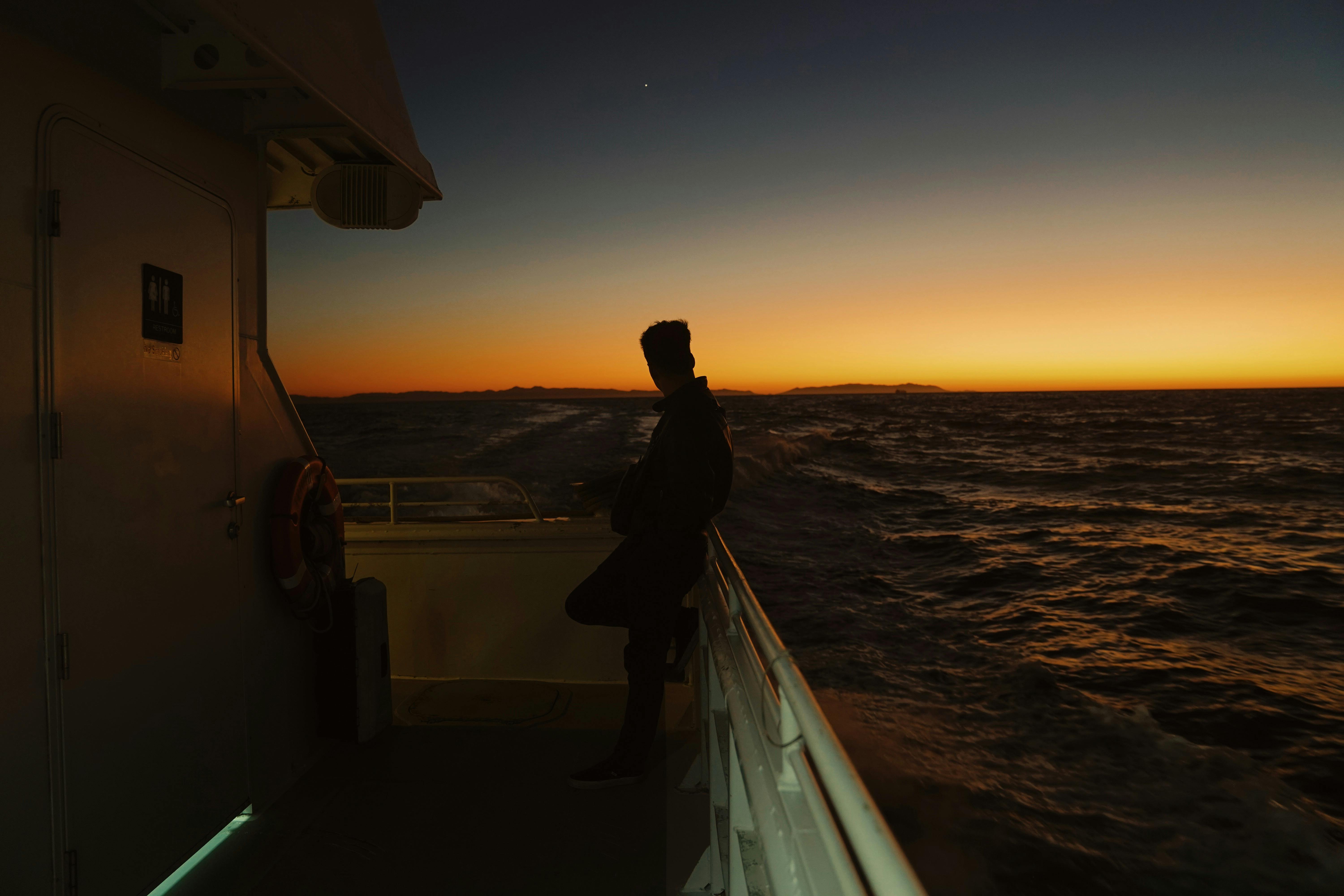 Silhouette at Sunset on Long Beach Boat Ride · Free Stock Photo