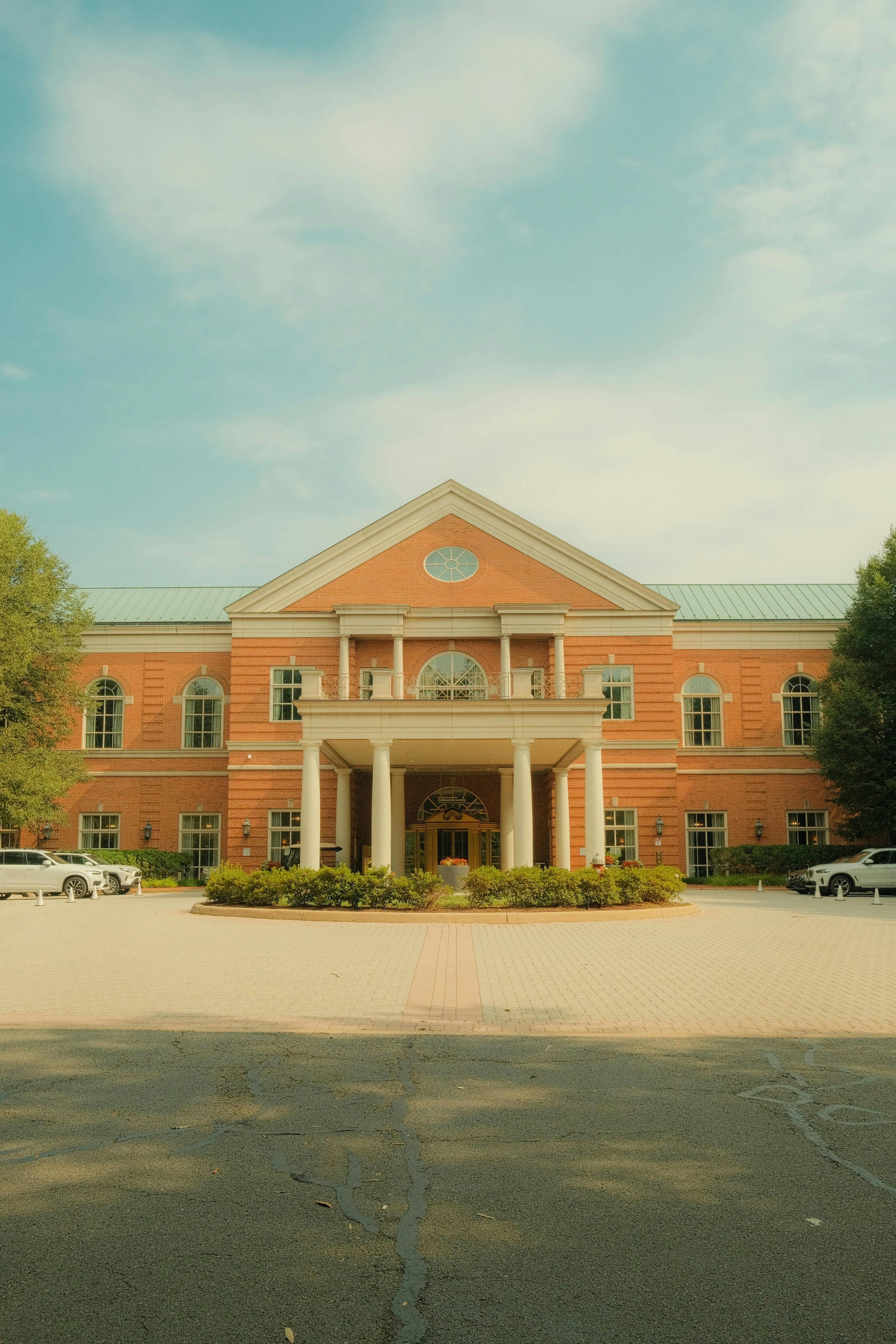 Classic Brick Building in Sunny Setting · Free Stock Photo