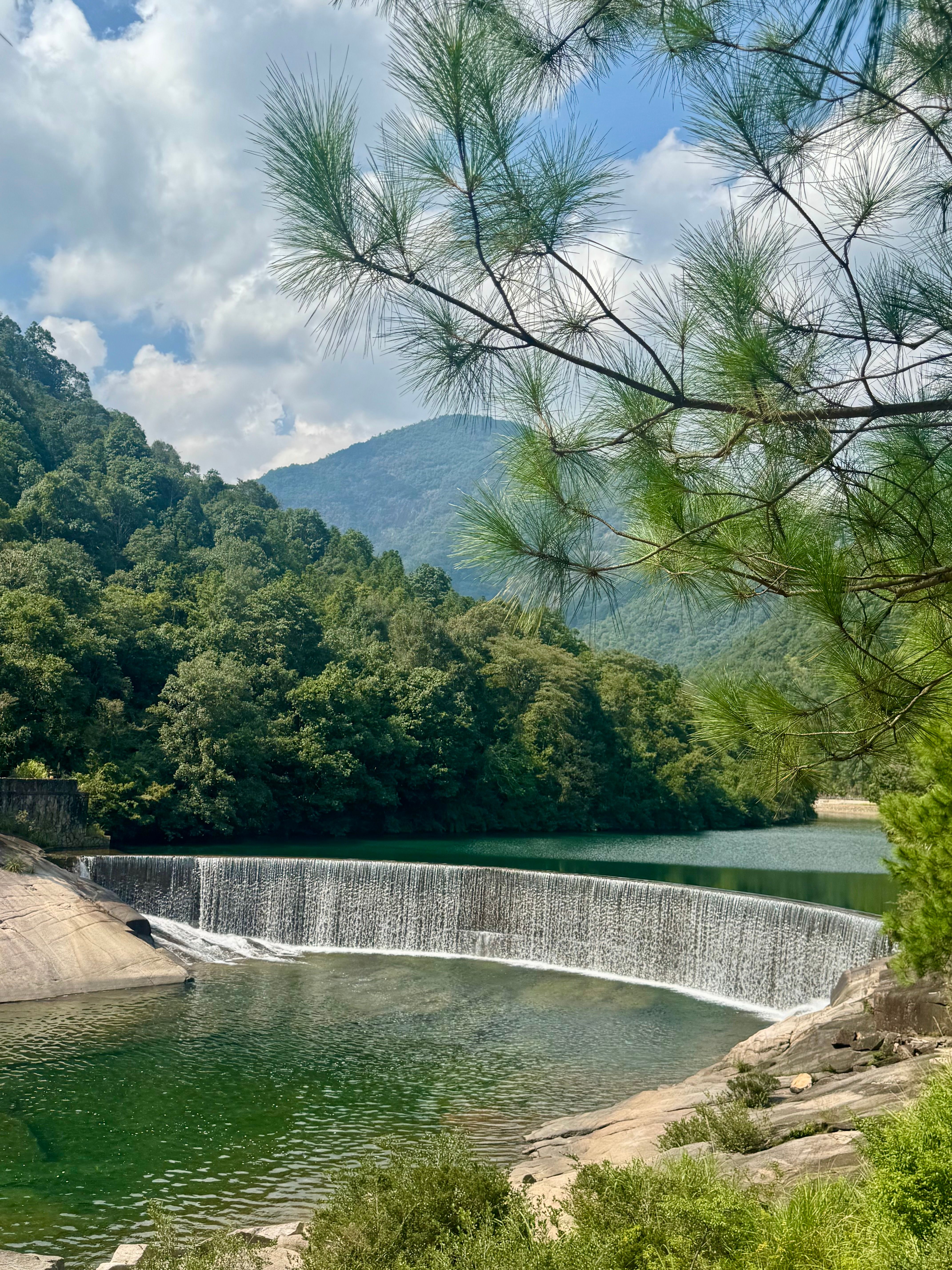 Scenic Dam with Waterfall in Verdant Mountain Valley · Free Stock Photo