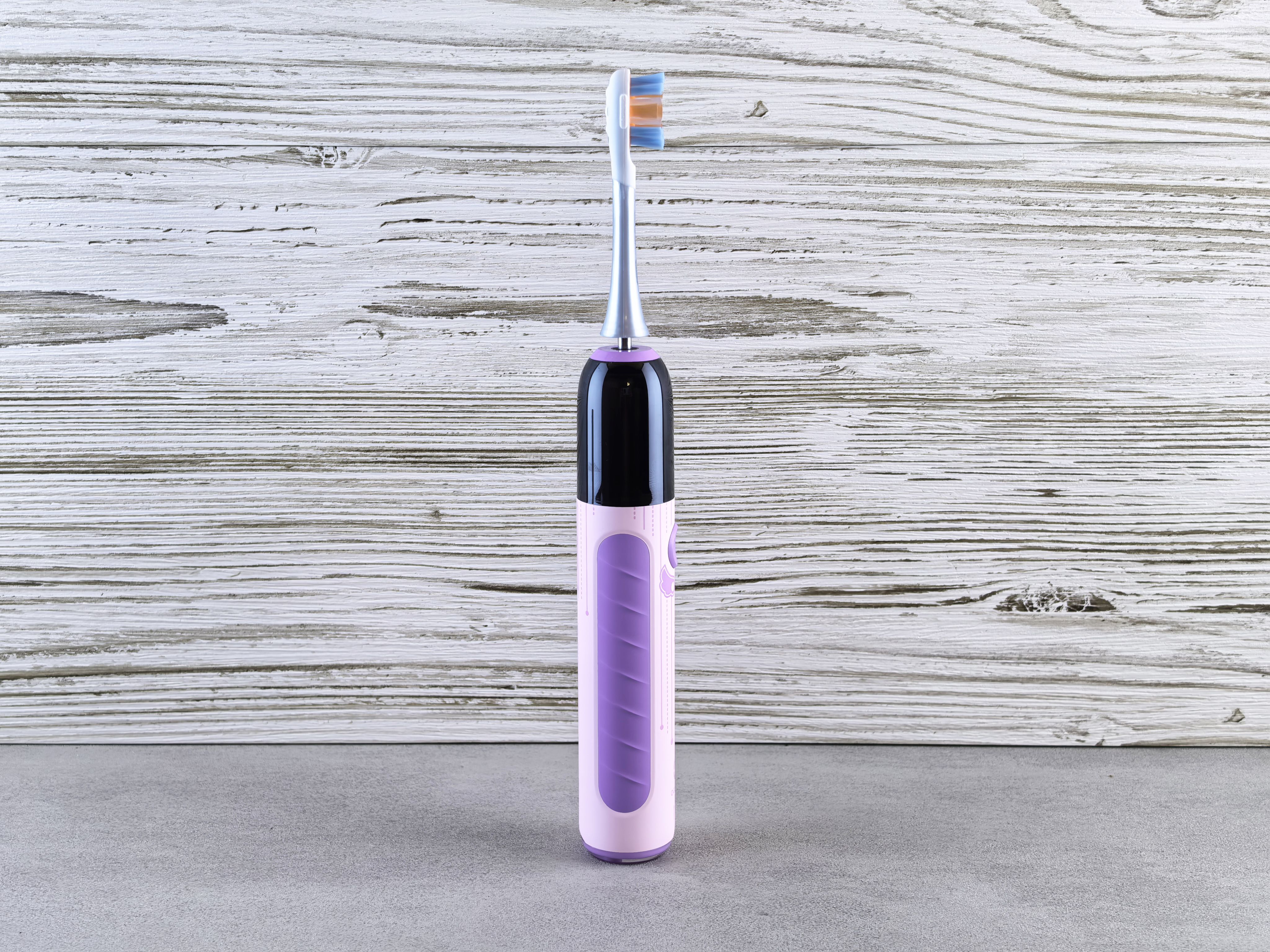 Electric Toothbrush on Wooden Background · Free Stock Photo