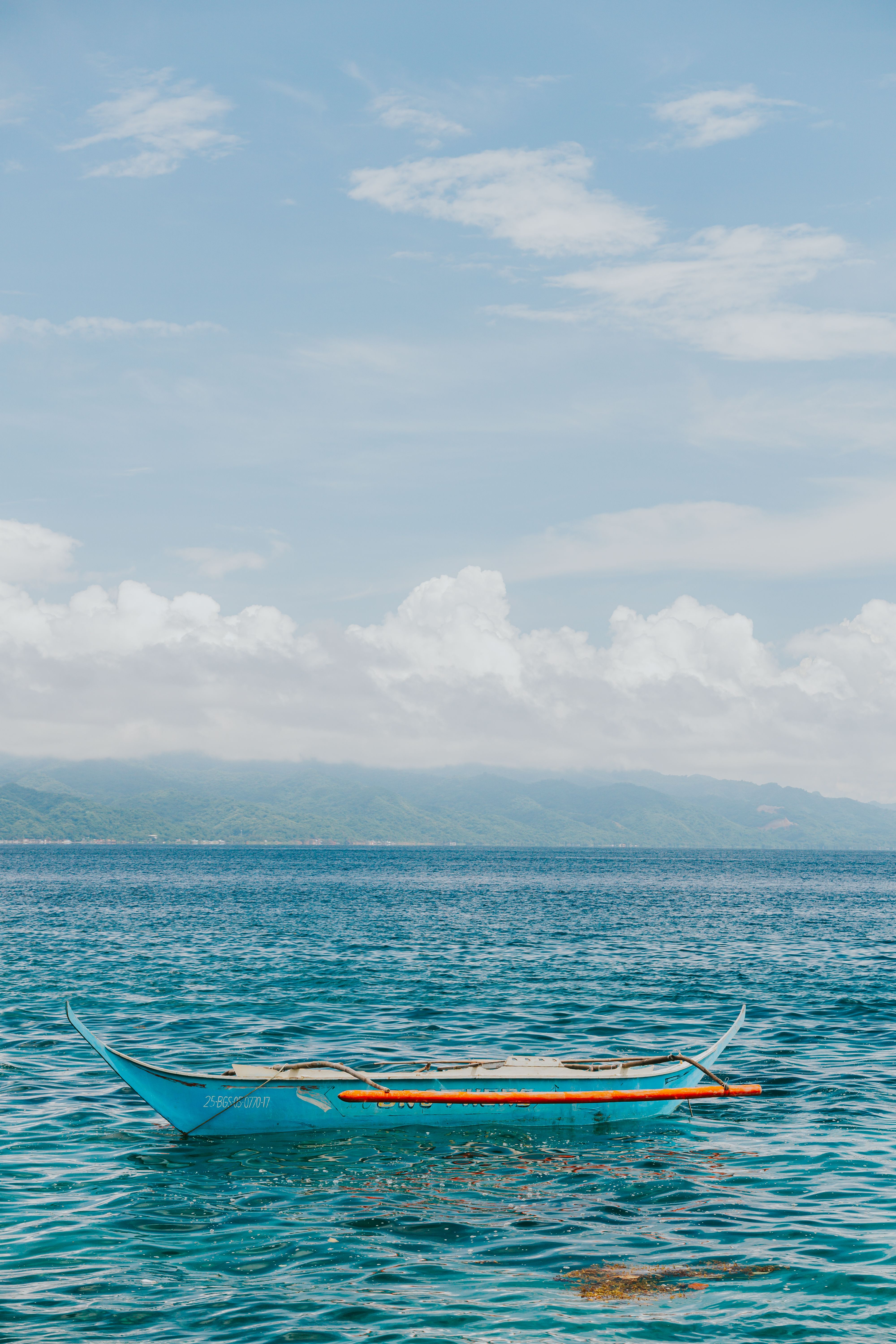 Idyllic Seascape with Traditional Boat · Free Stock Photo