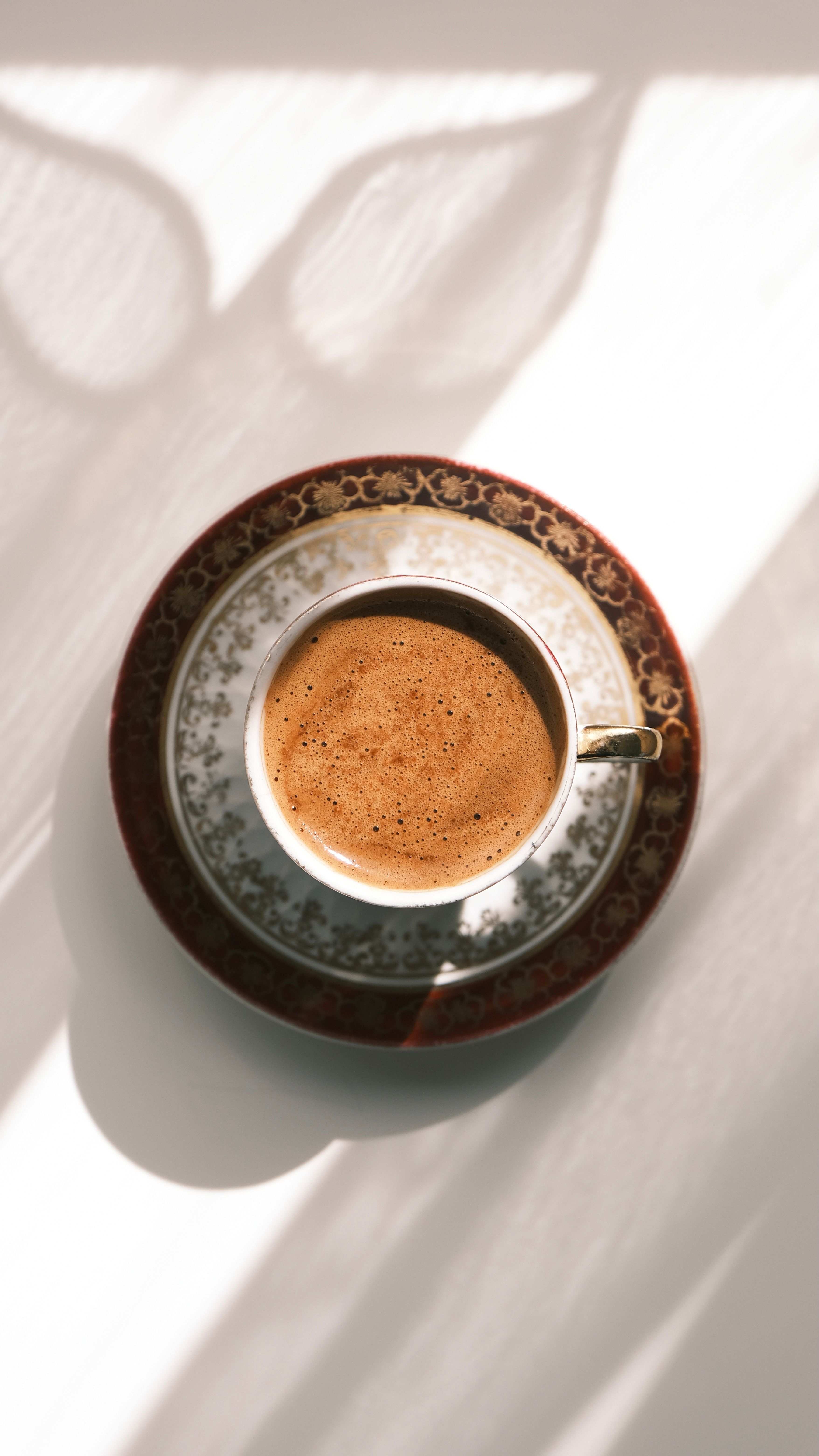 Elegant Espresso Cup in Sunlight · Free Stock Photo