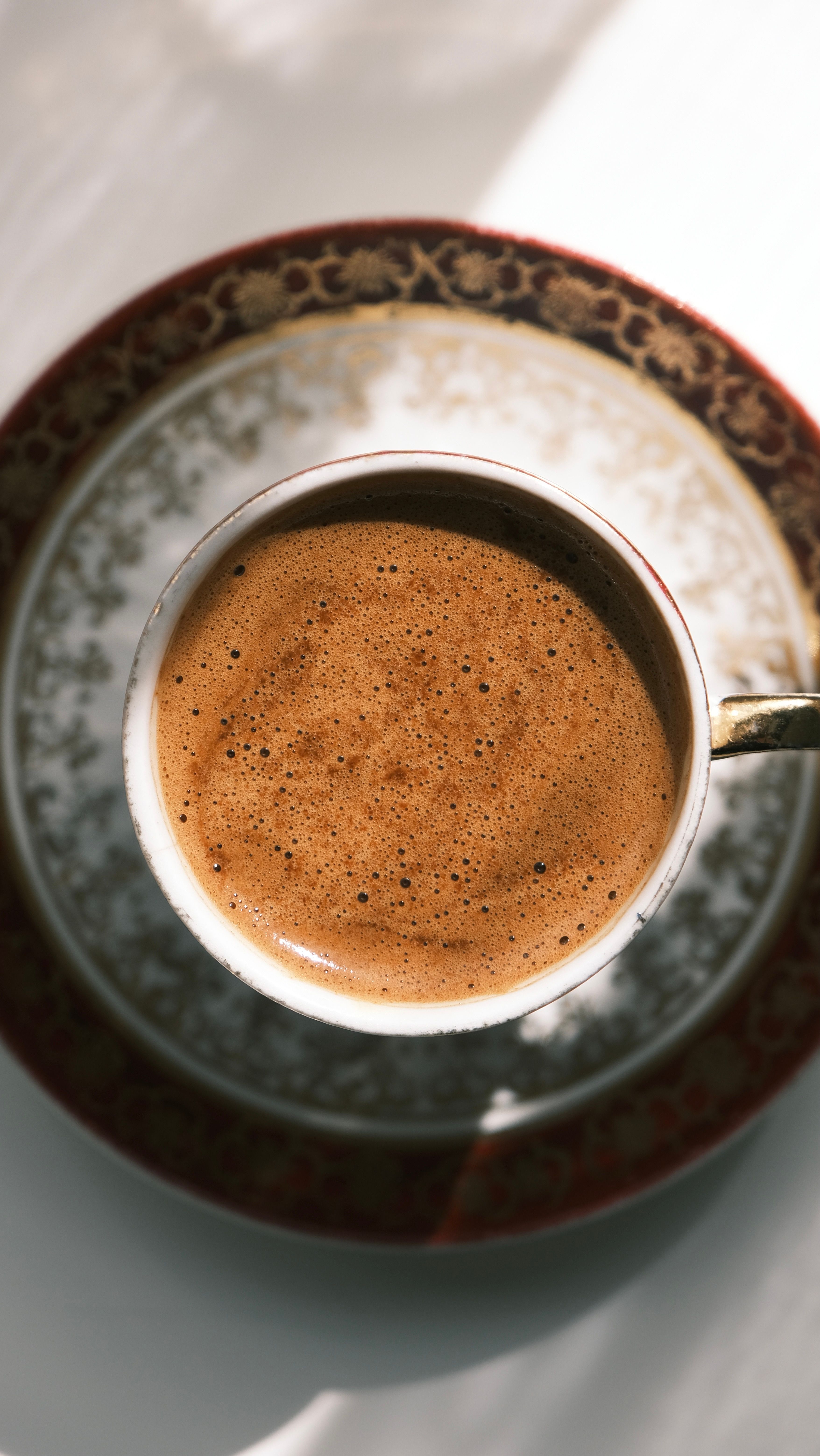 Elegant Espresso Cup in Sunlight · Free Stock Photo