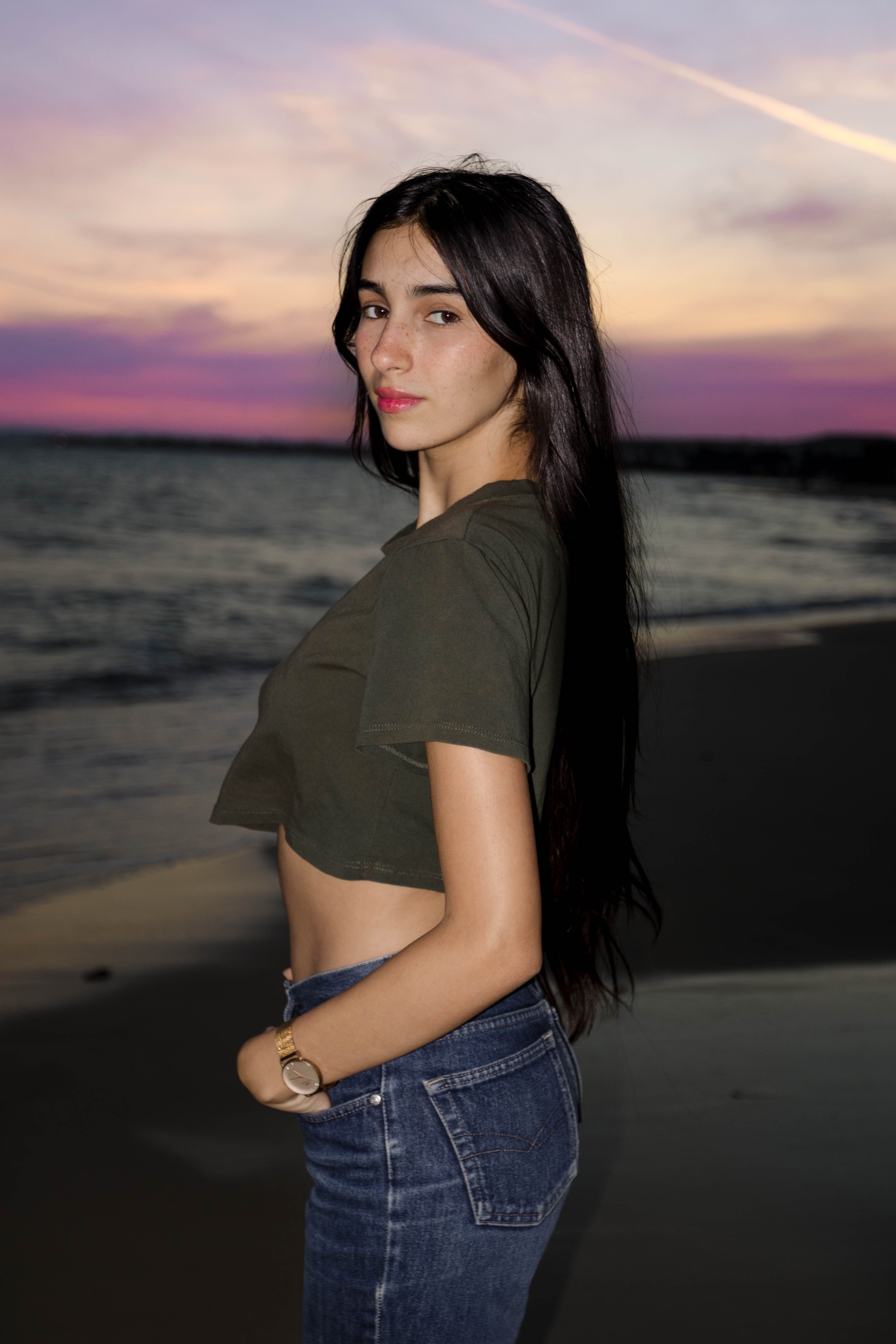 Young Woman at Sunset Beach · Free Stock Photo