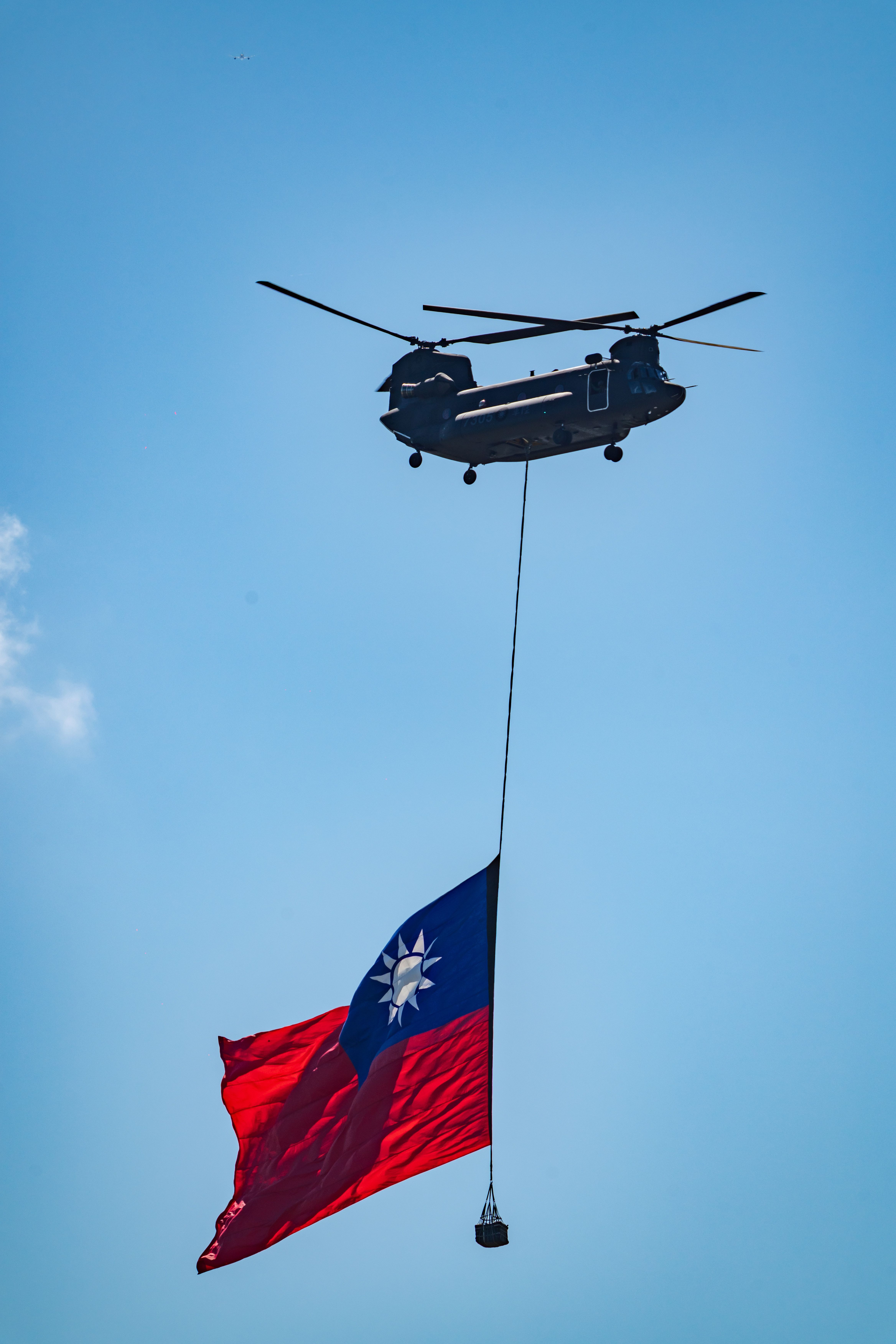 Helicopter Flying Taiwan Flag in Blue Sky · Free Stock Photo