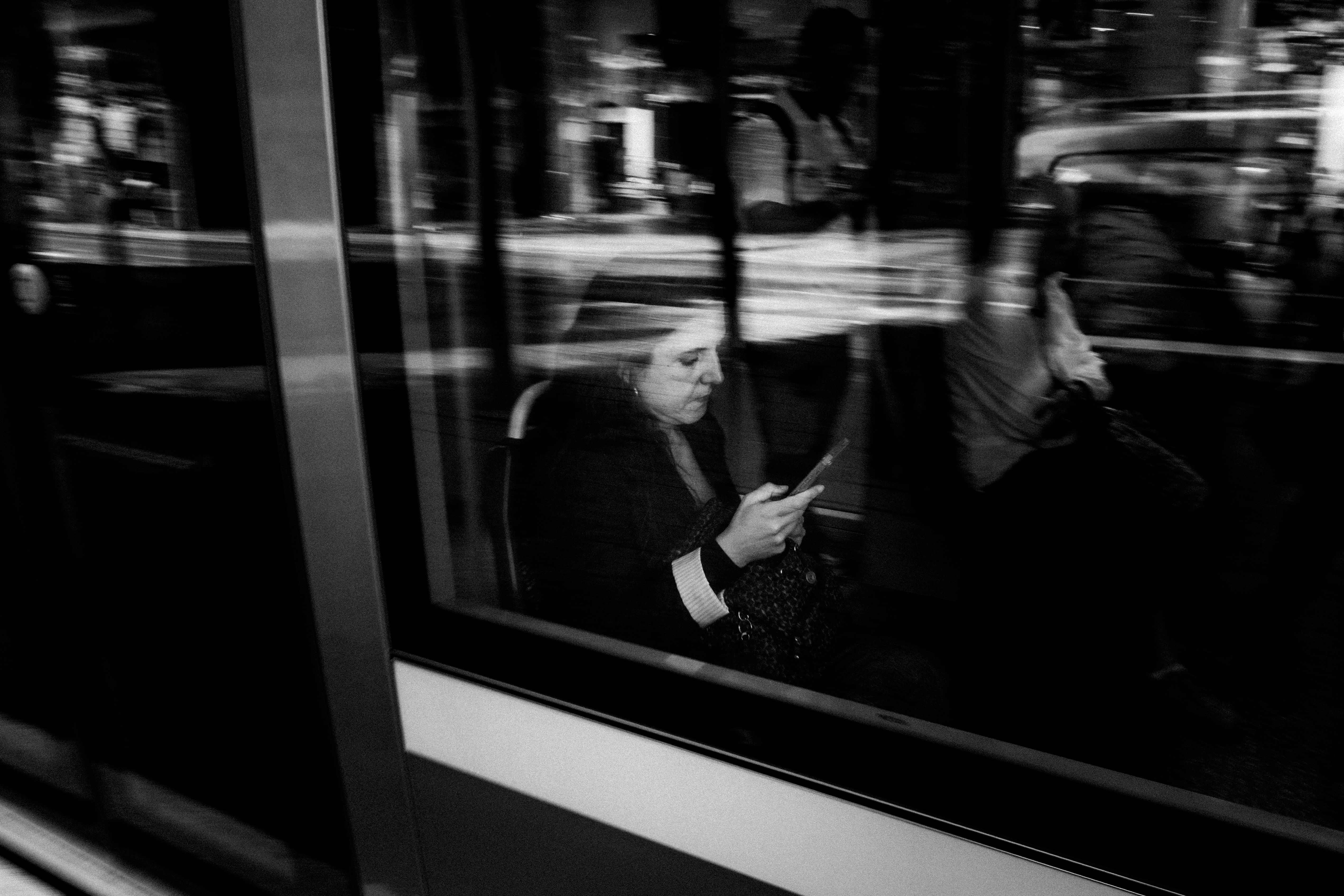 Reflection of Commuters on a Bus in Dublin · Free Stock Photo
