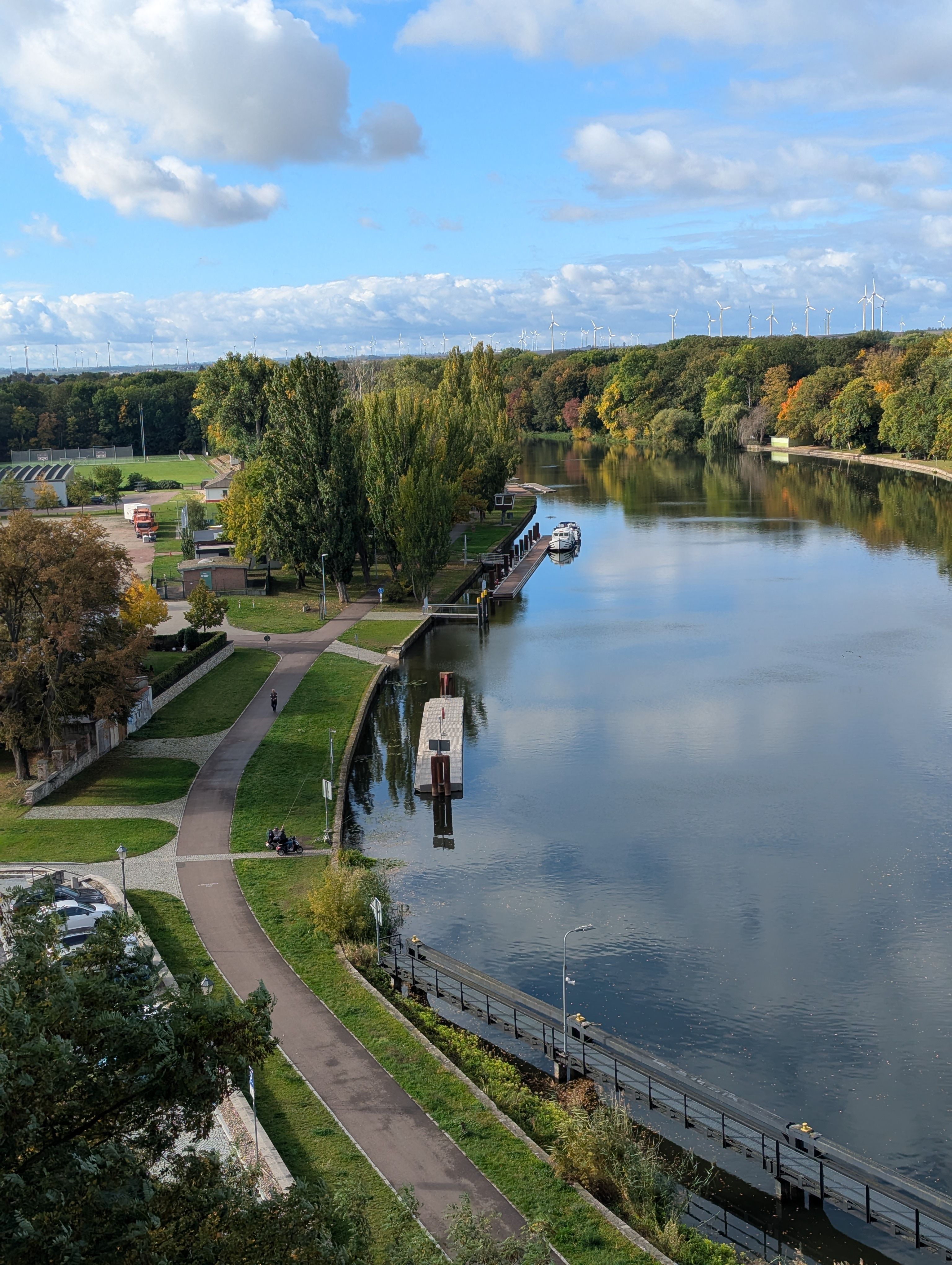 Scenic River with Autumn Foliage and Pathway · Free Stock Photo