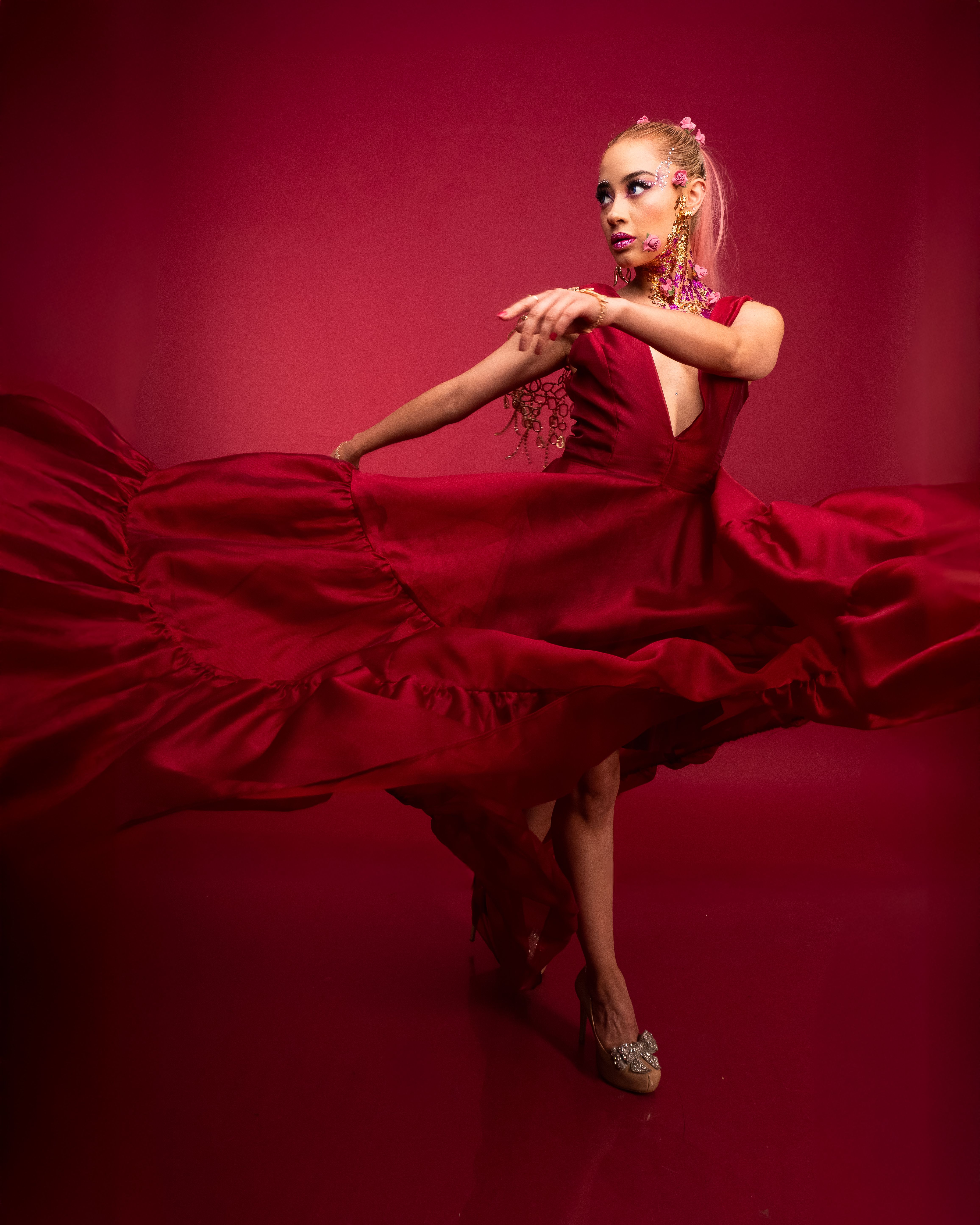 Elegant Dancer in Flowing Red Dress Captured Mid-Motion · Free Stock Photo