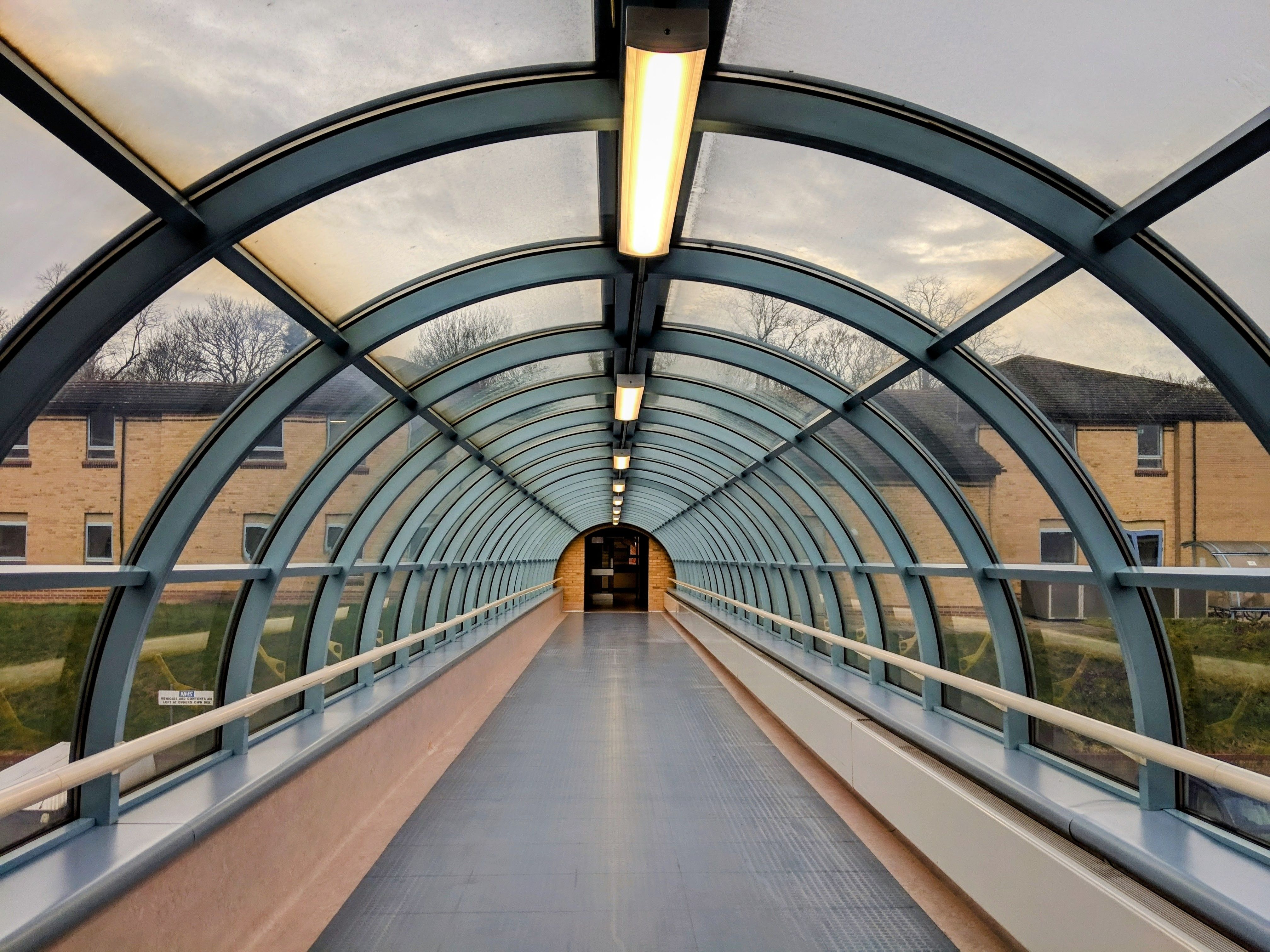 Modern Arched Walkway with Glass Roof in England · Free Stock Photo