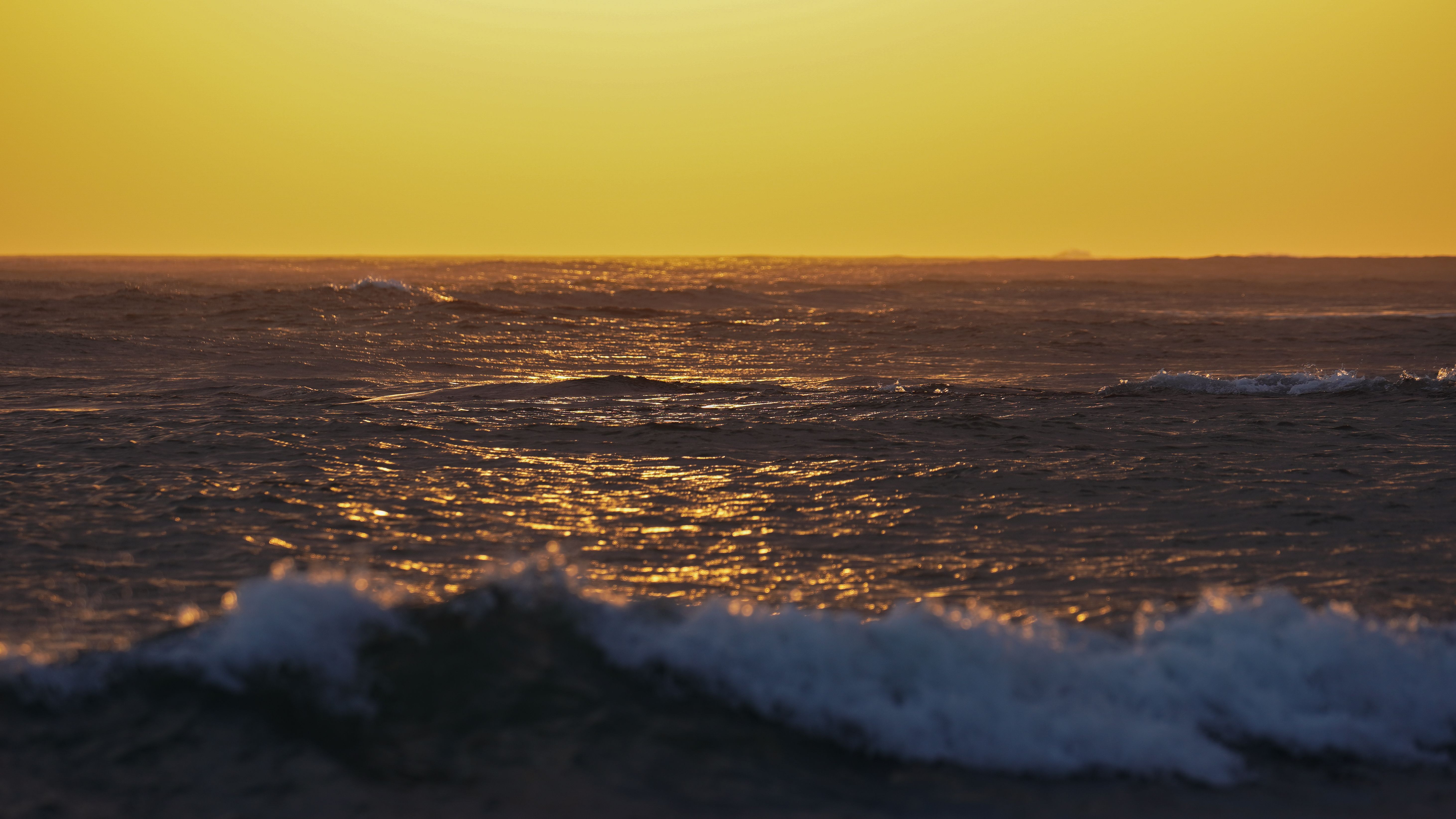 Golden Sunset Over Ocean Waves · Free Stock Photo