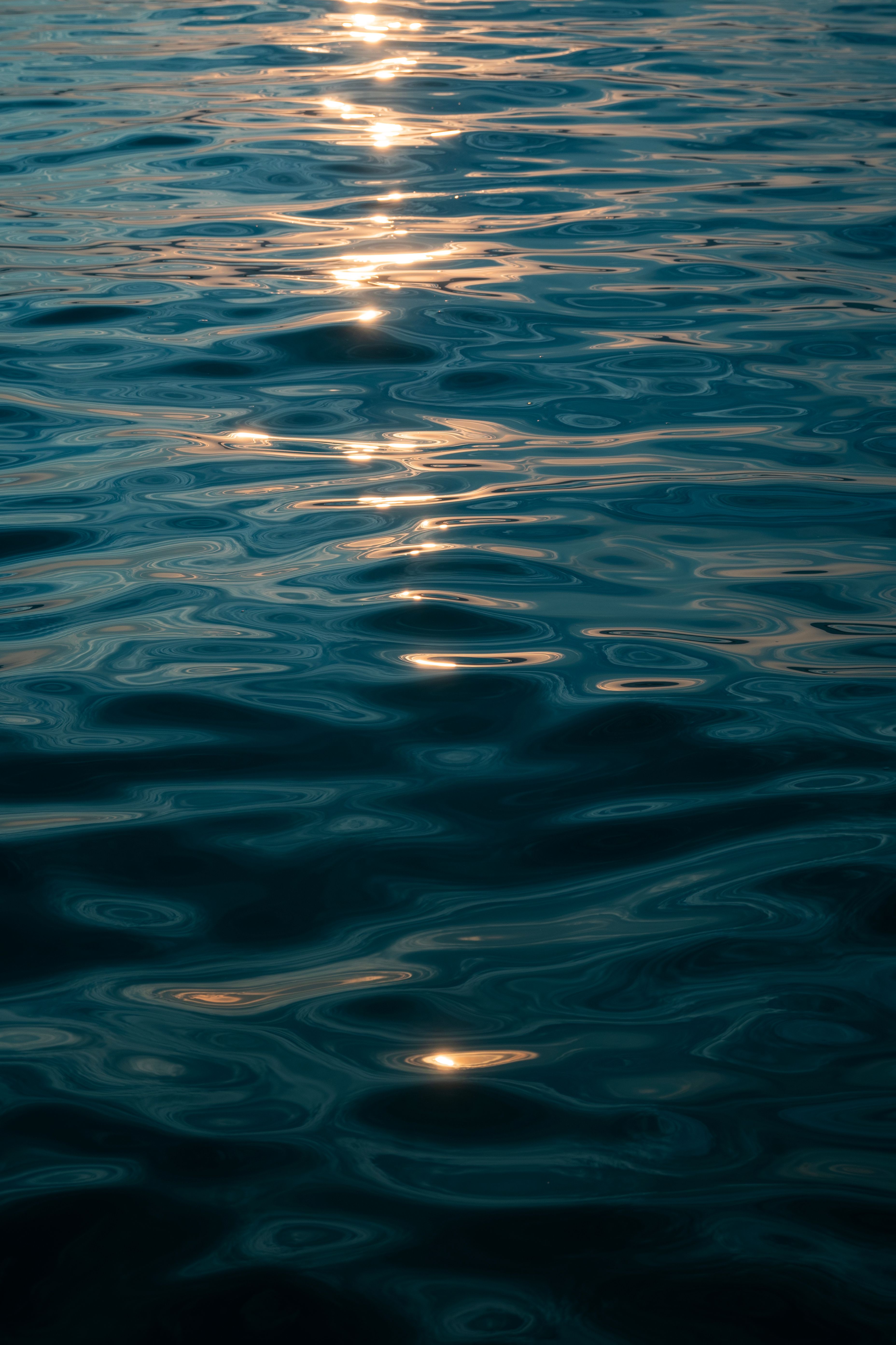 Sunset Reflection on Rippling Water Surface · Free Stock Photo