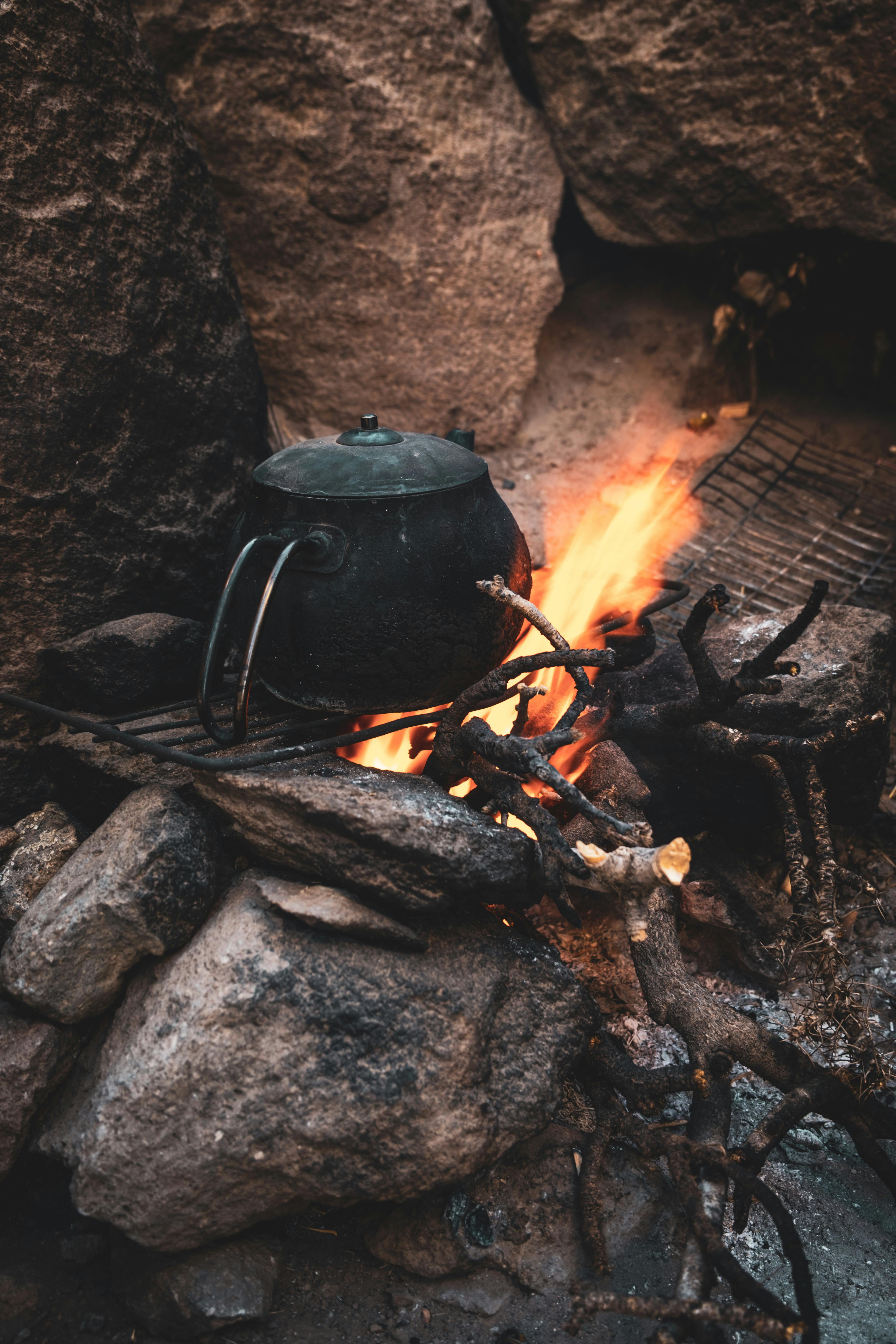 Rustic Campfire with Teapot in Wilderness · Free Stock Photo