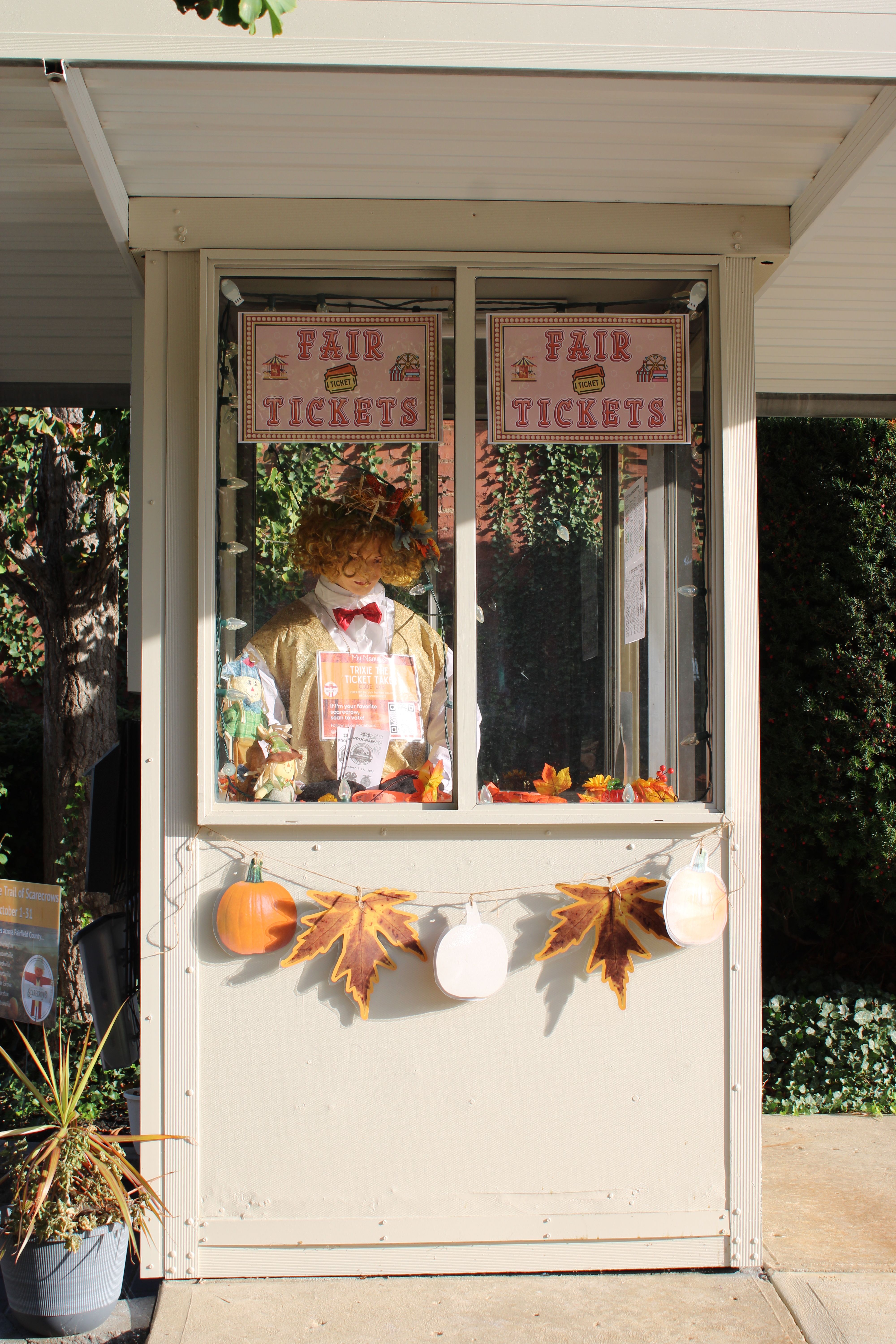 Charming Fall Fair Ticket Booth with Scarecrow Decor · Free Stock Photo