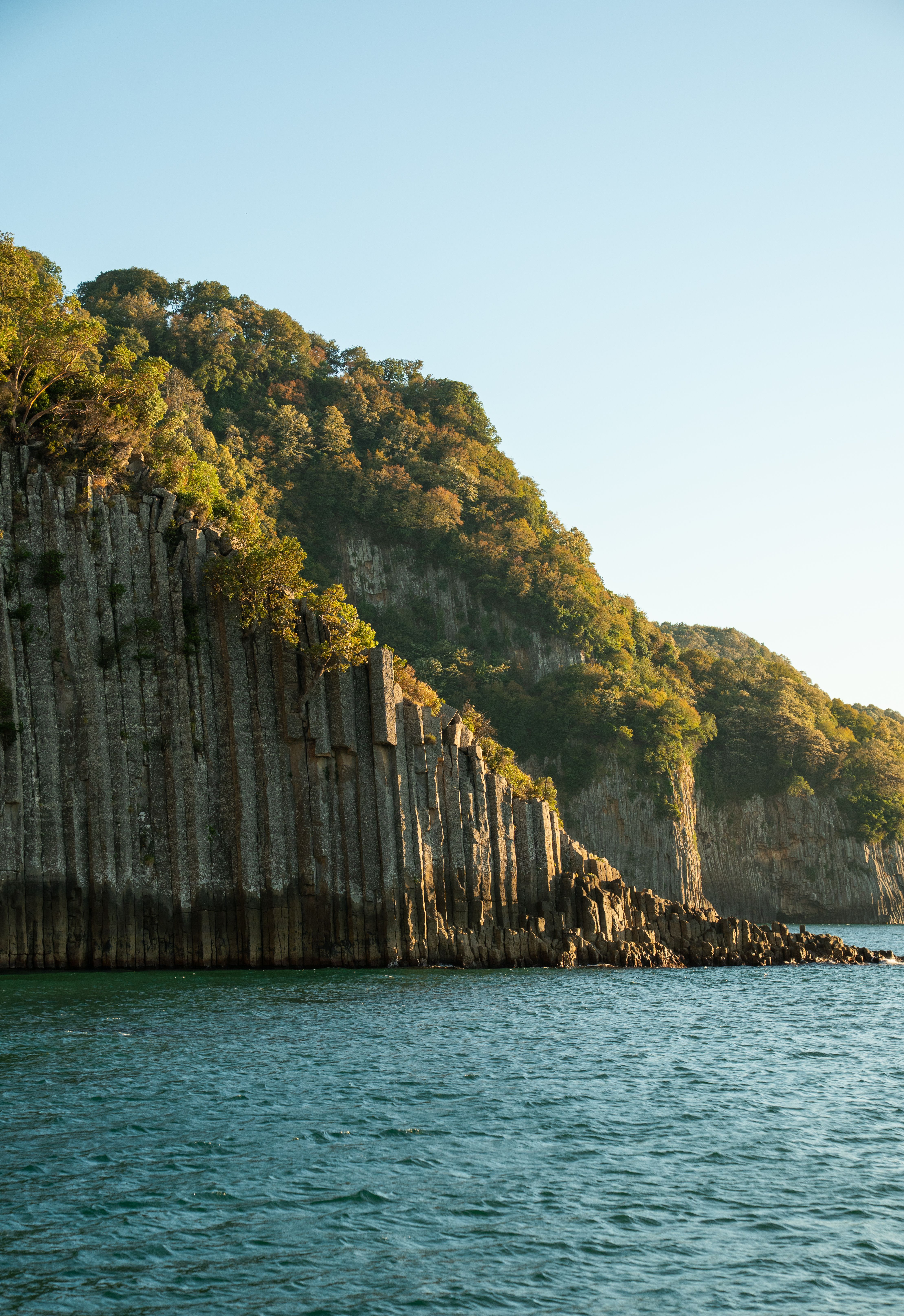 Scenic Coastal Cliffs at Sunset · Free Stock Photo