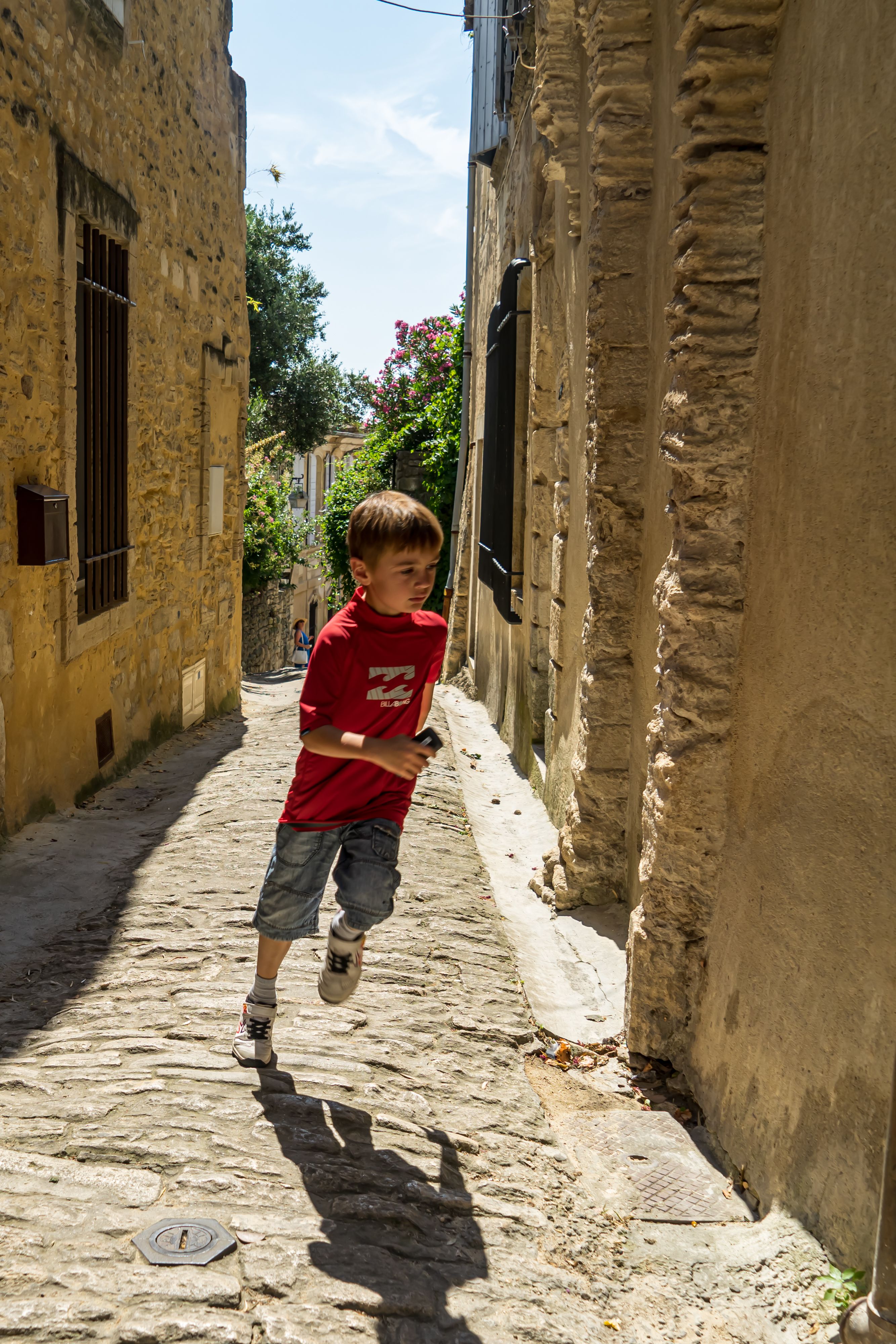 Child Running Through Historic Alleyway · Free Stock Photo