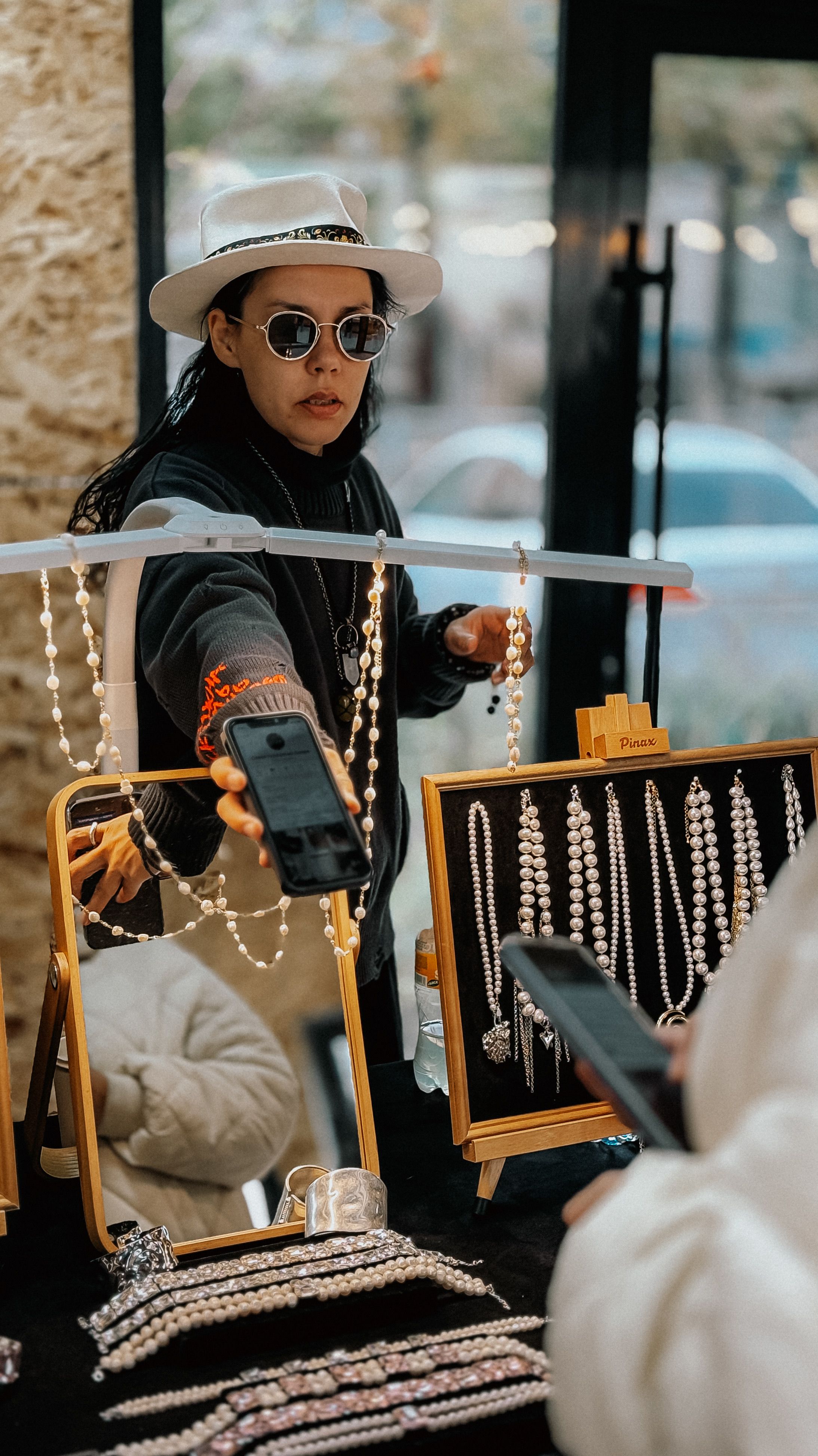 Trendy Street Vendor Displaying Handcrafted Jewelry · Free Stock Photo