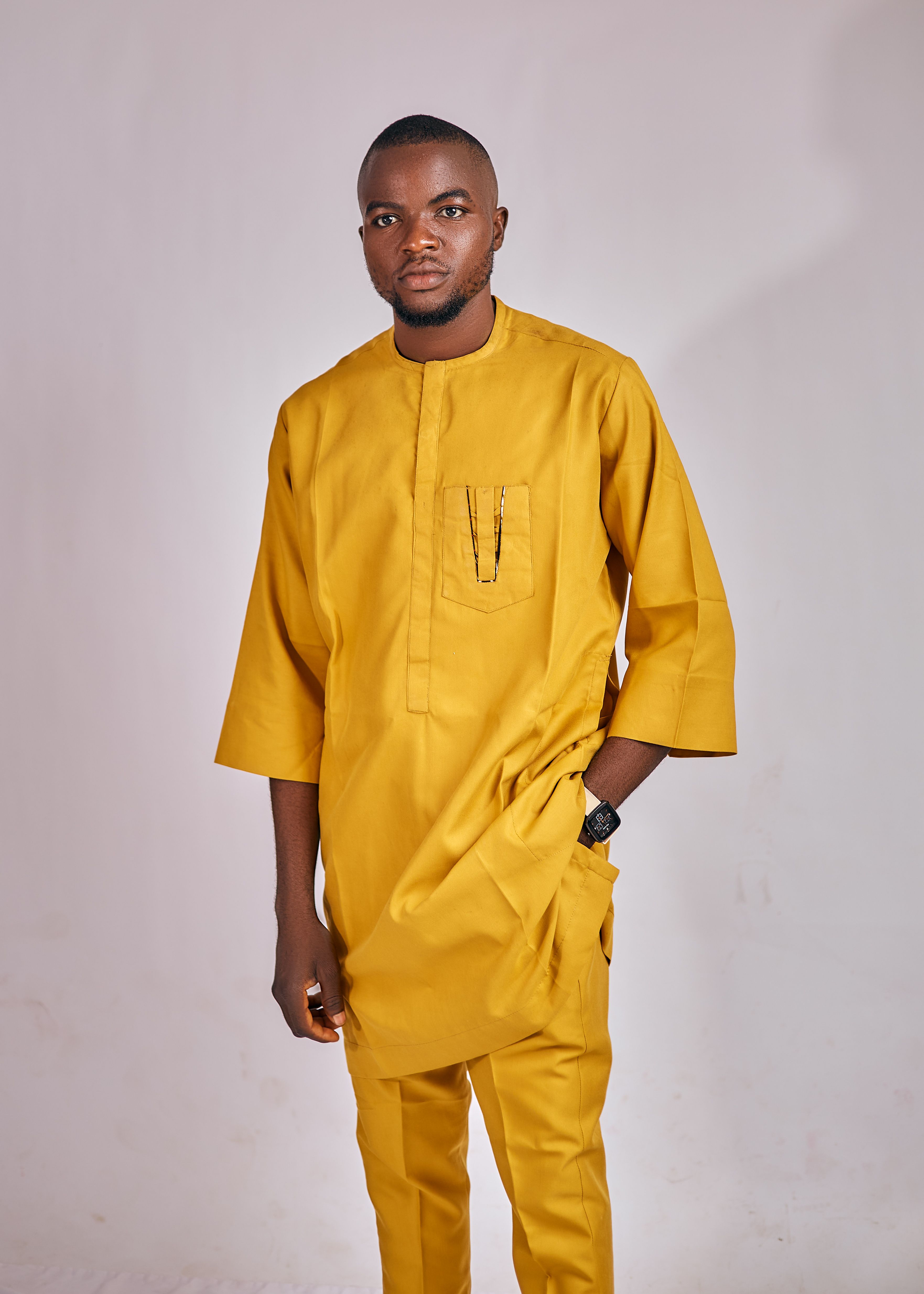 Man in Traditional Yellow African Attire · Free Stock Photo