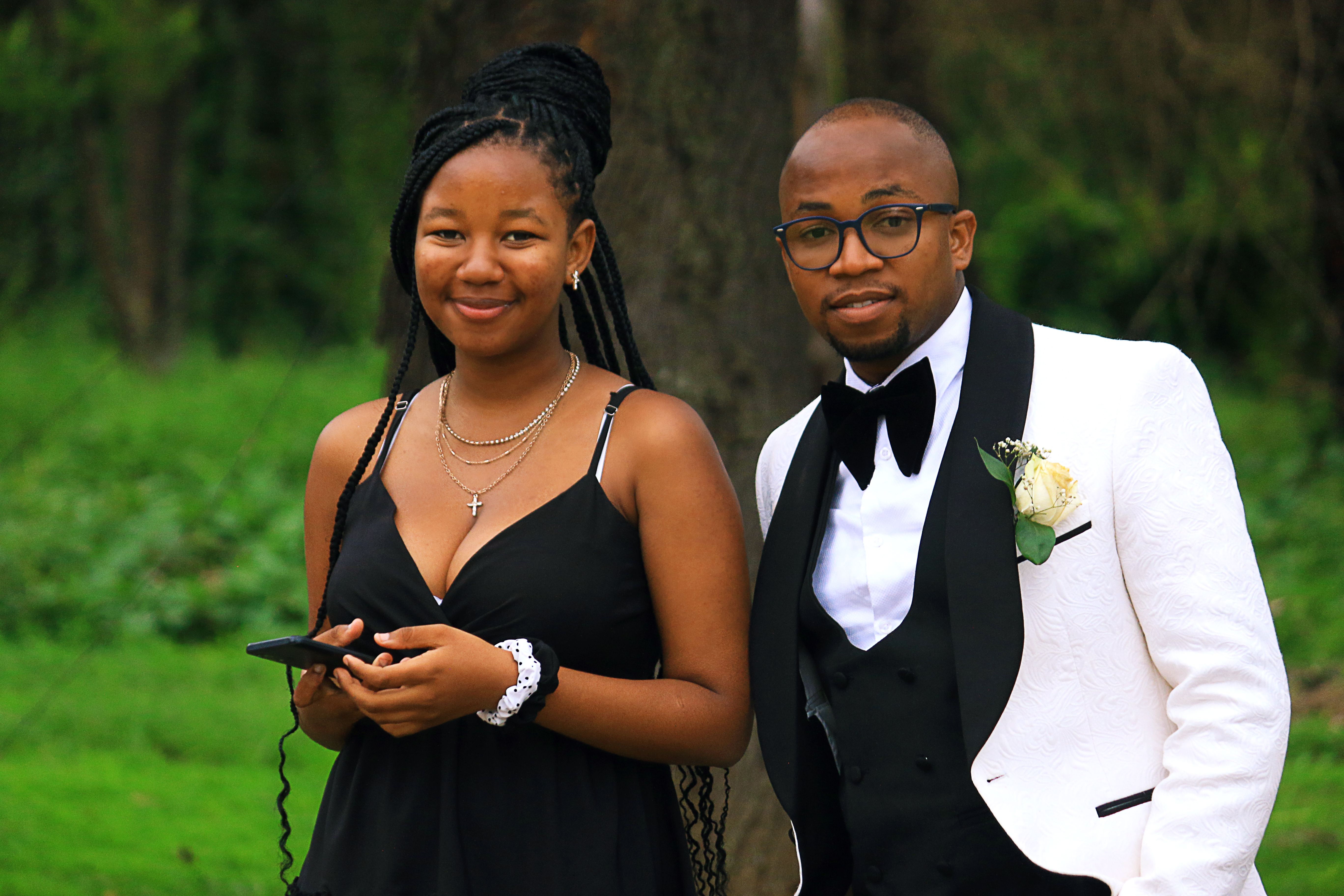 Elegant Couple Posing Outdoors at Event · Free Stock Photo