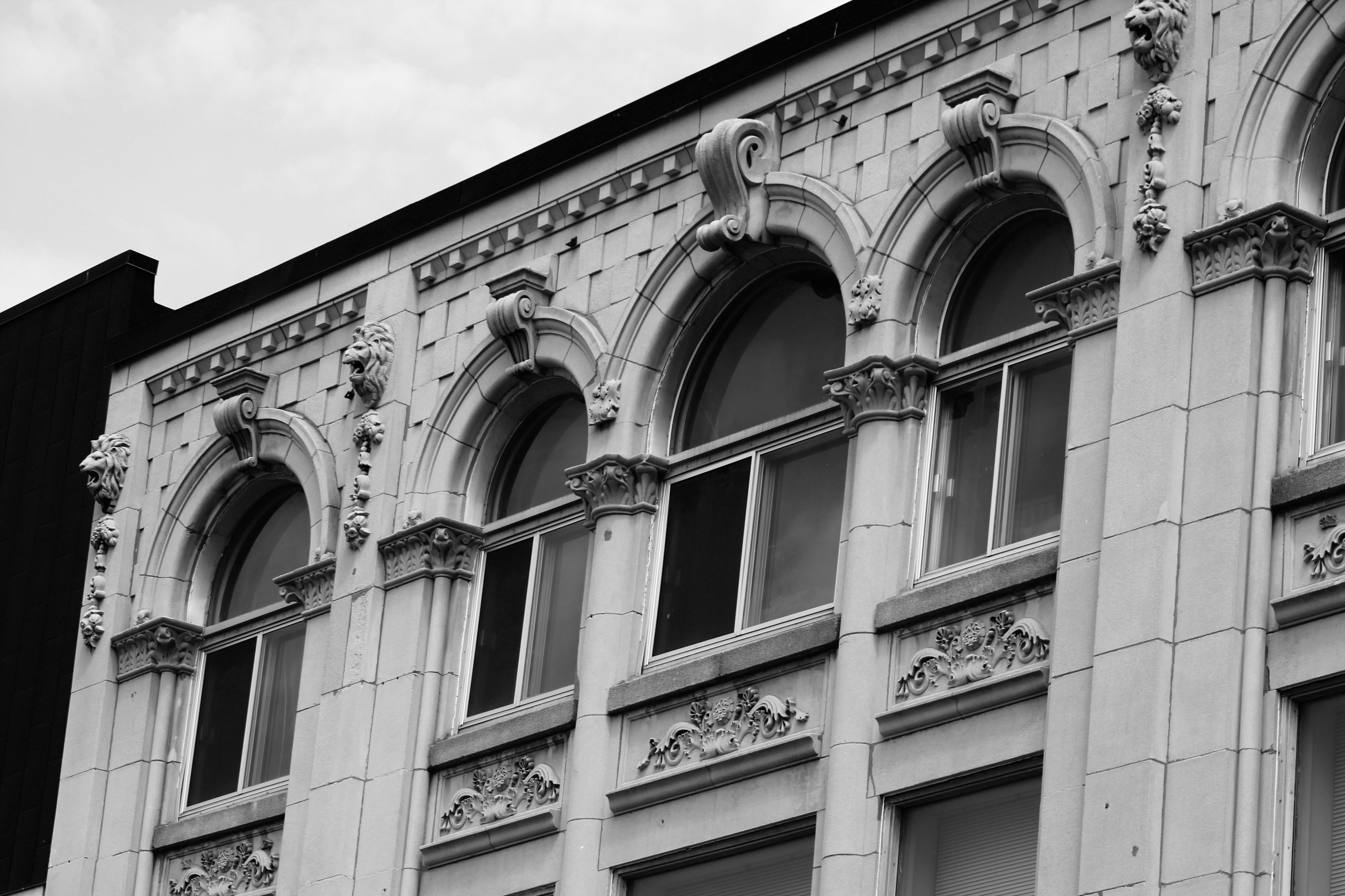 Historic Building Facade with Ornate Stonework · Free Stock Photo