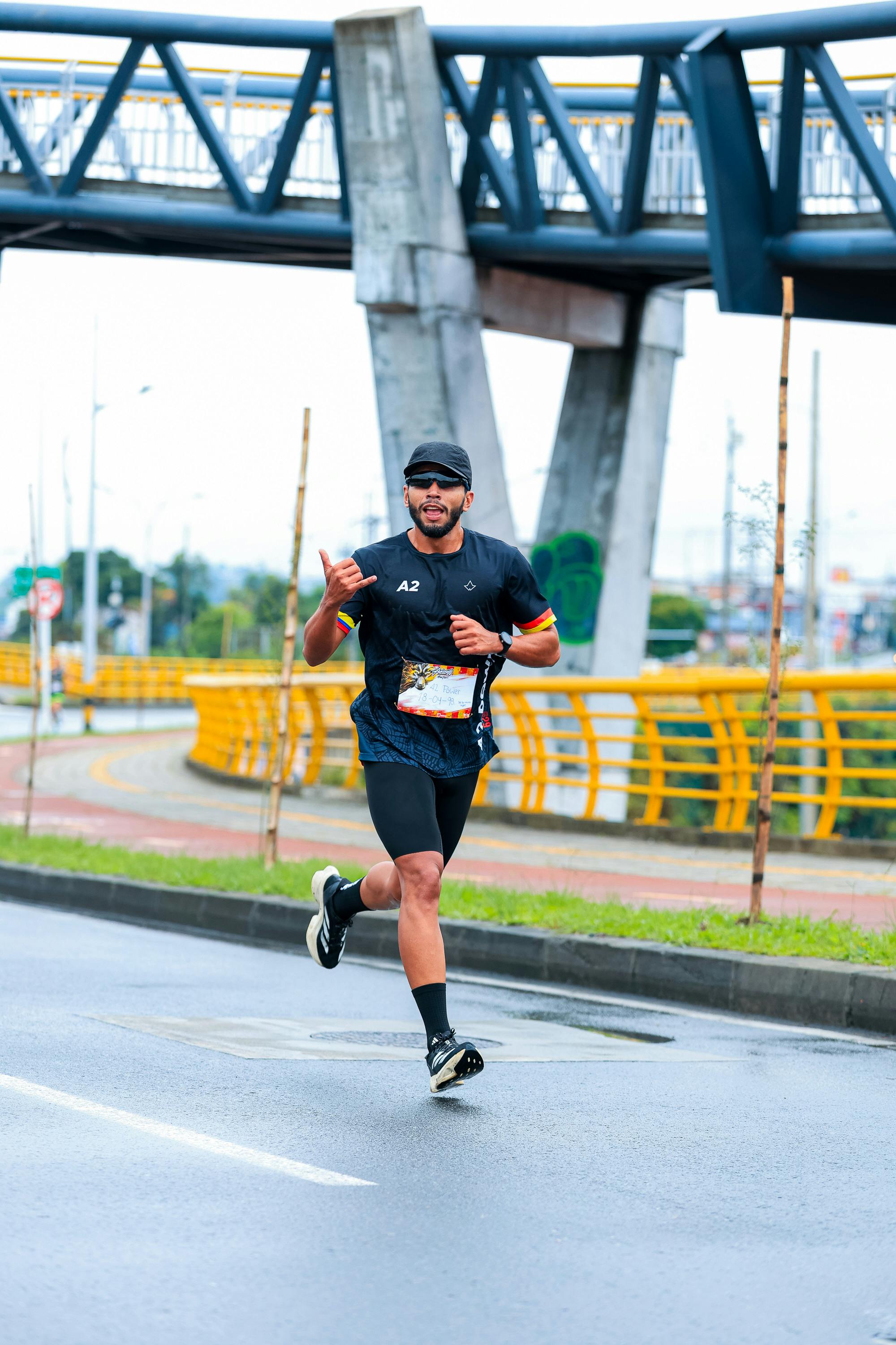 Energetic Runner in Urban Marathon Setting · Free Stock Photo