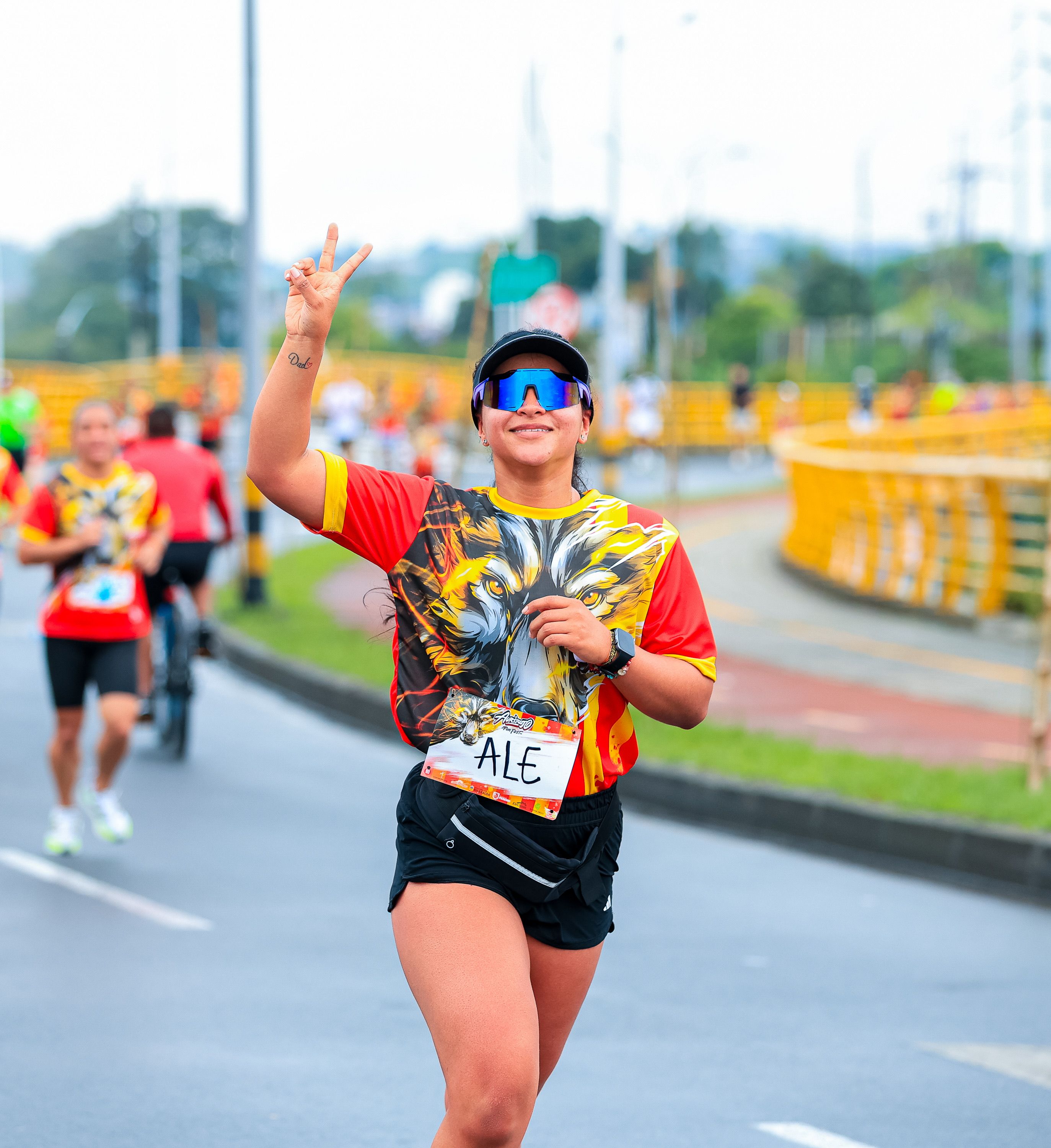 Marathon Runner Celebrating Victory on Road · Free Stock Photo
