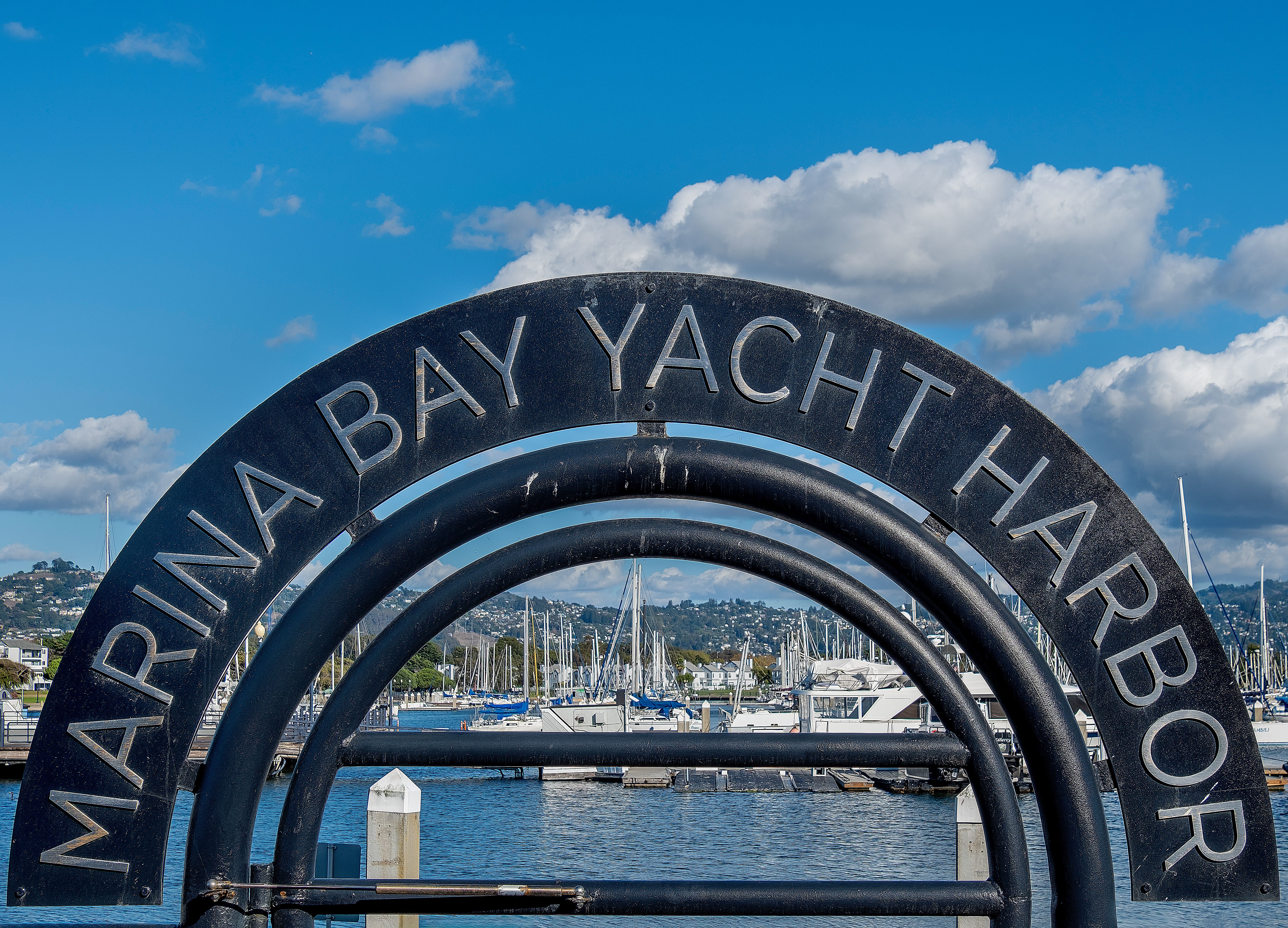 Marina Bay Yacht Harbor Sign with Boats · Free Stock Photo
