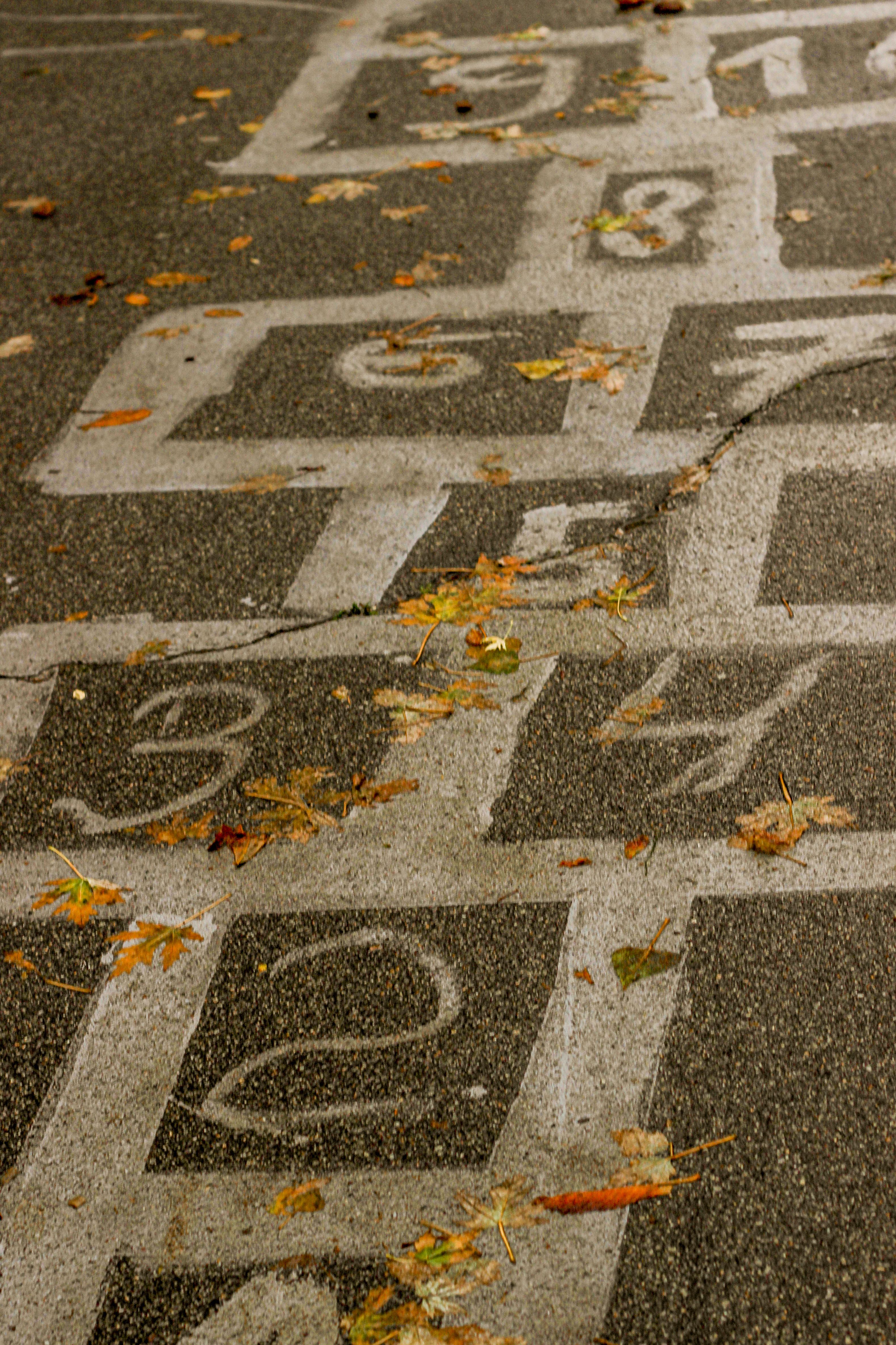 Mural of Walking Girl behind Hopscotch on Pavement · Free Stock Photo